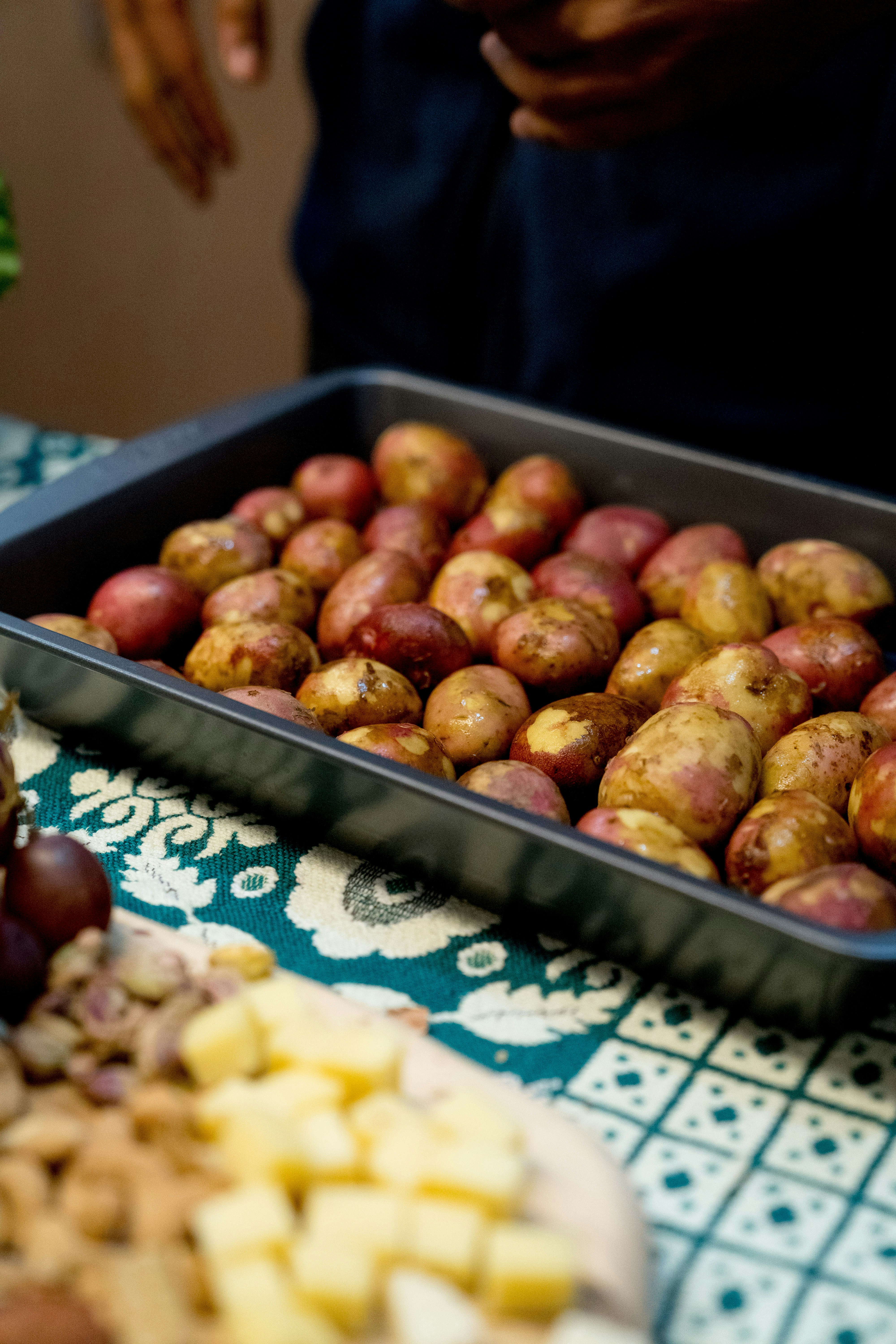 Tray of Roasted Potatoes Under Dim Kitchen Light