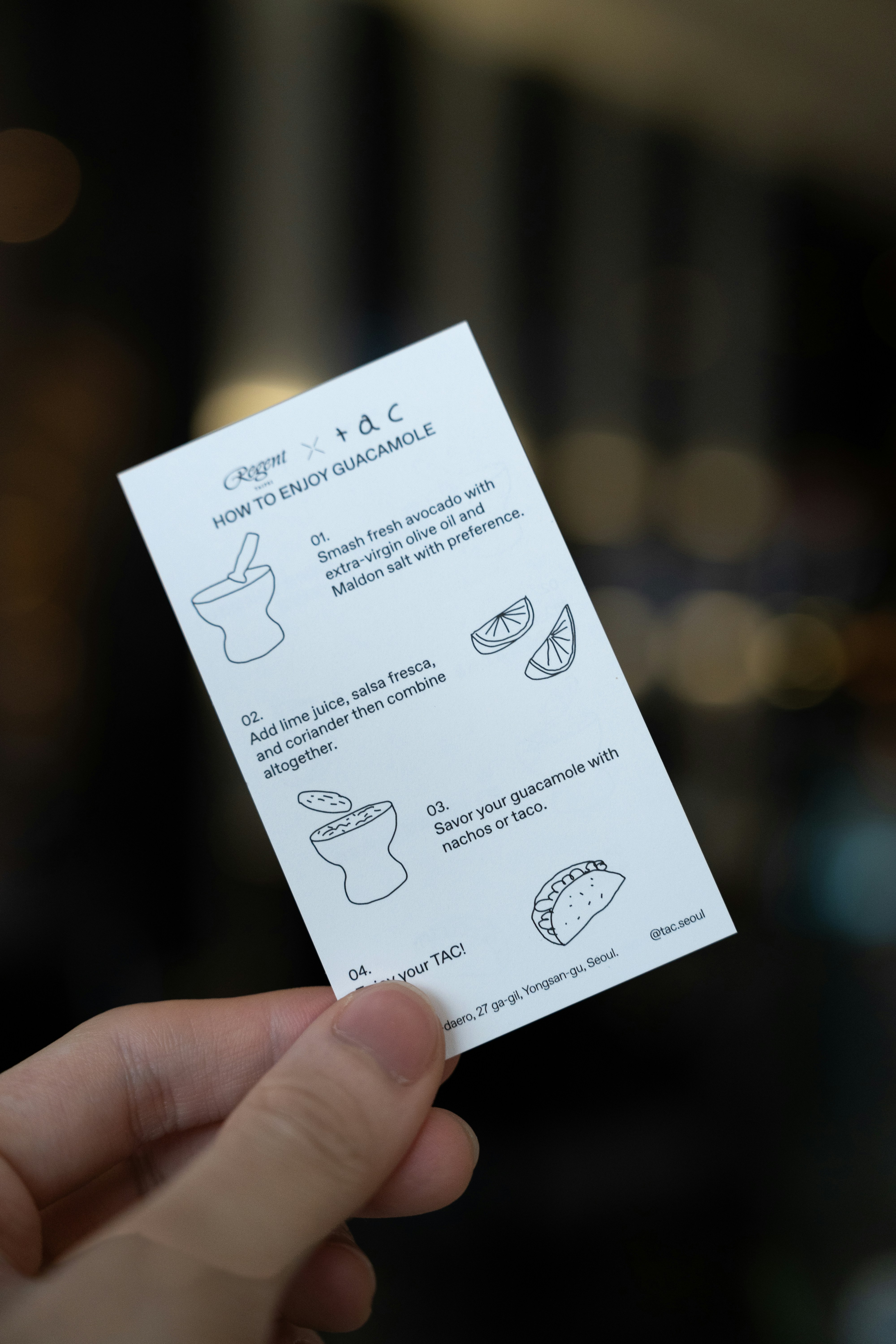 A hand holding a business card with instructions on it photo – Free ...