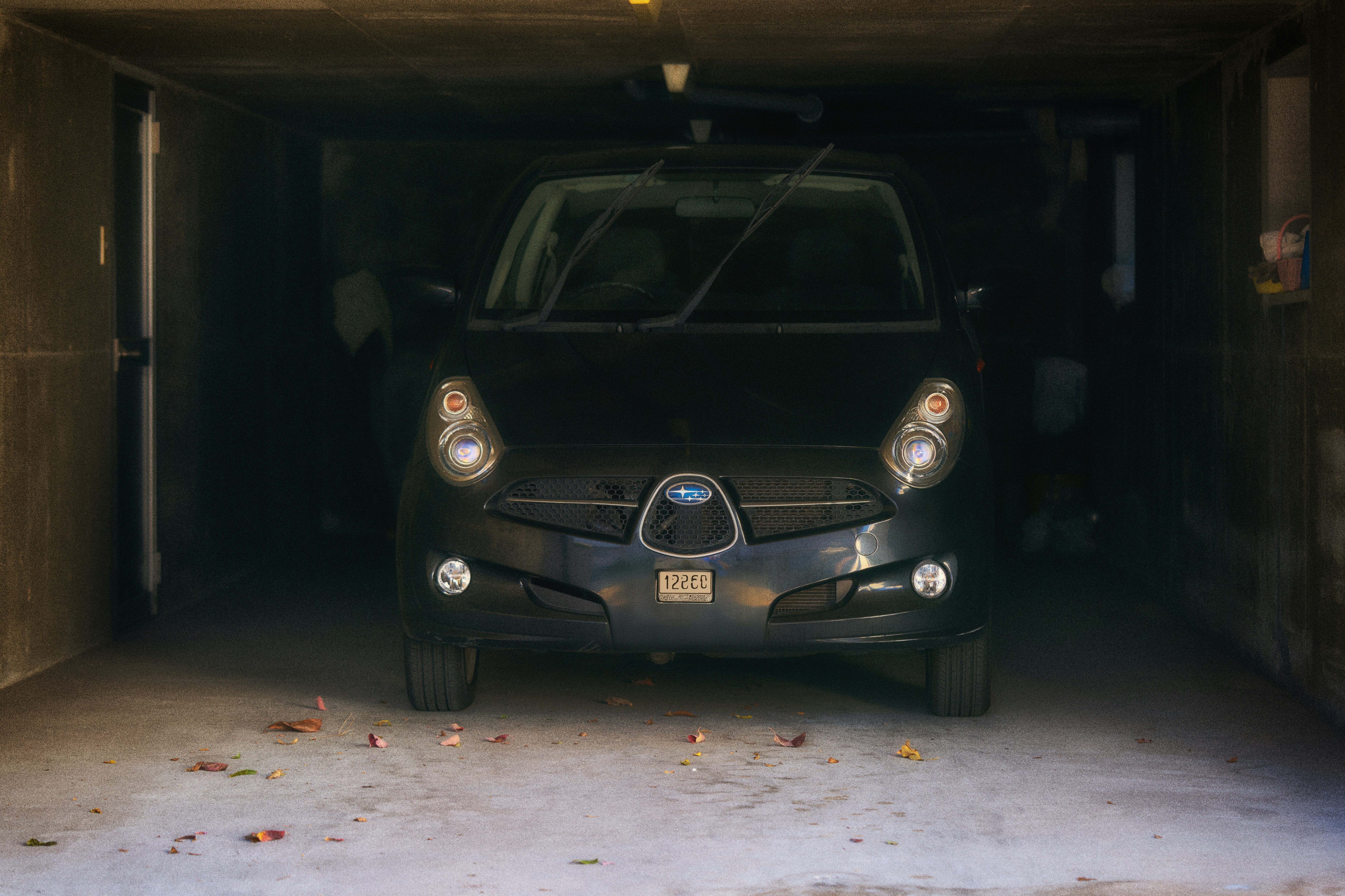 A car is parked inside of a garage