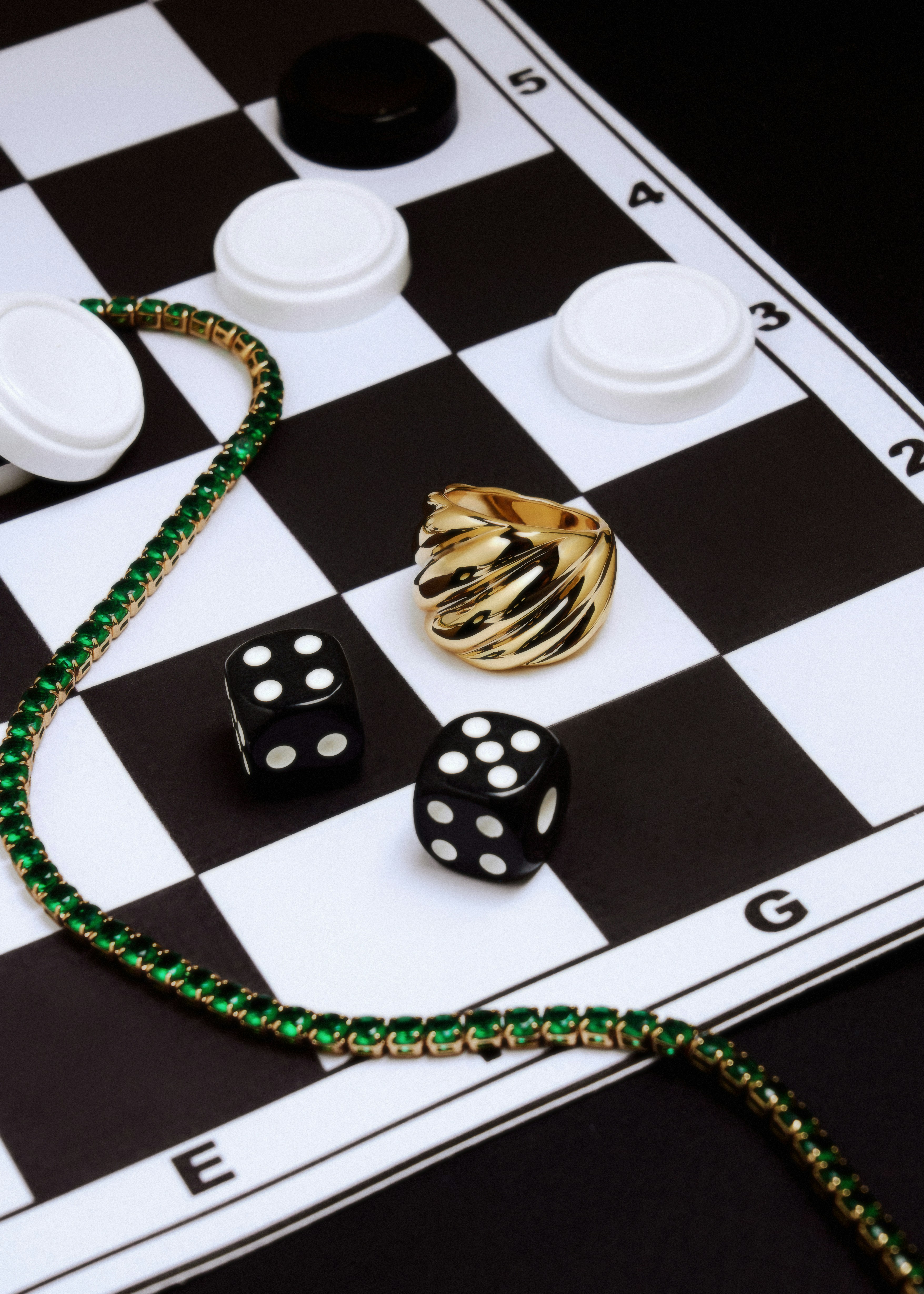 Gilded Ring on a Dice-Strewn Chessboard