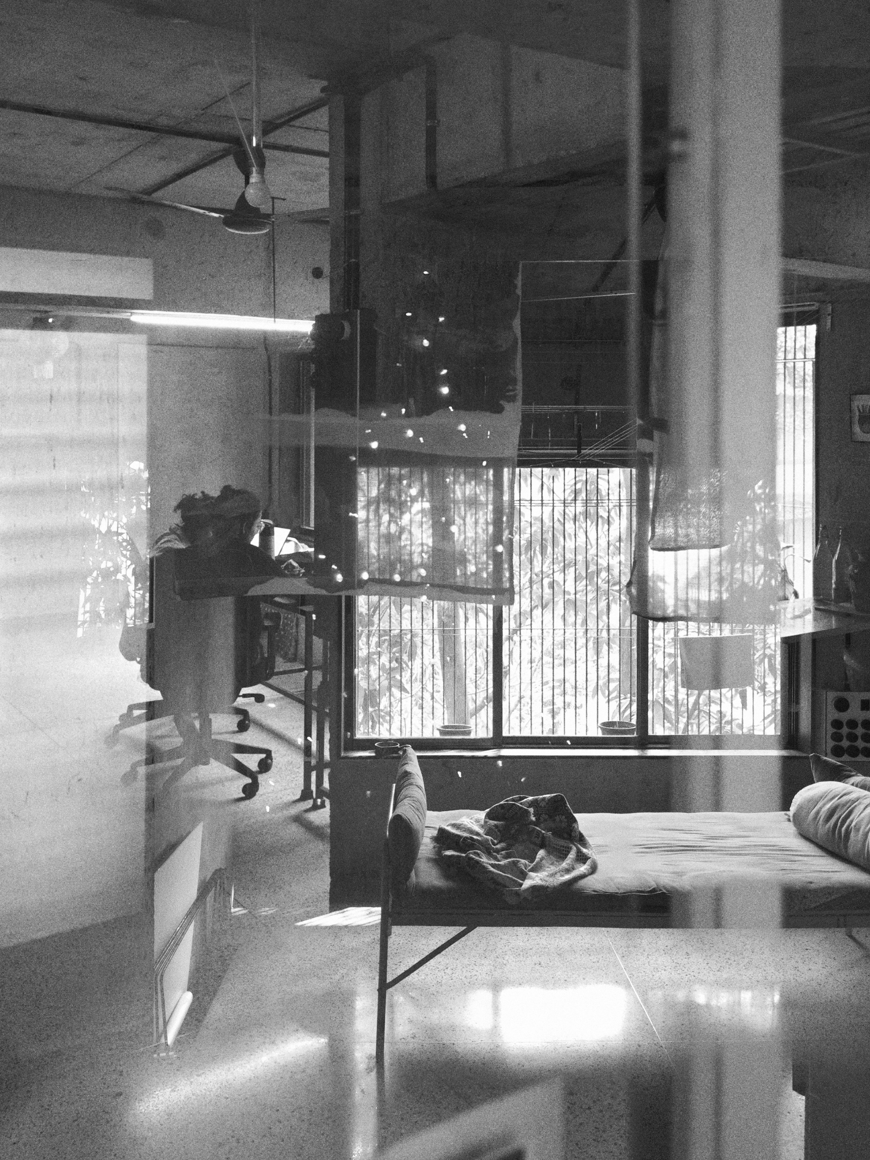 Glassbound Quiet: An Office Portrait Through Double Reflections