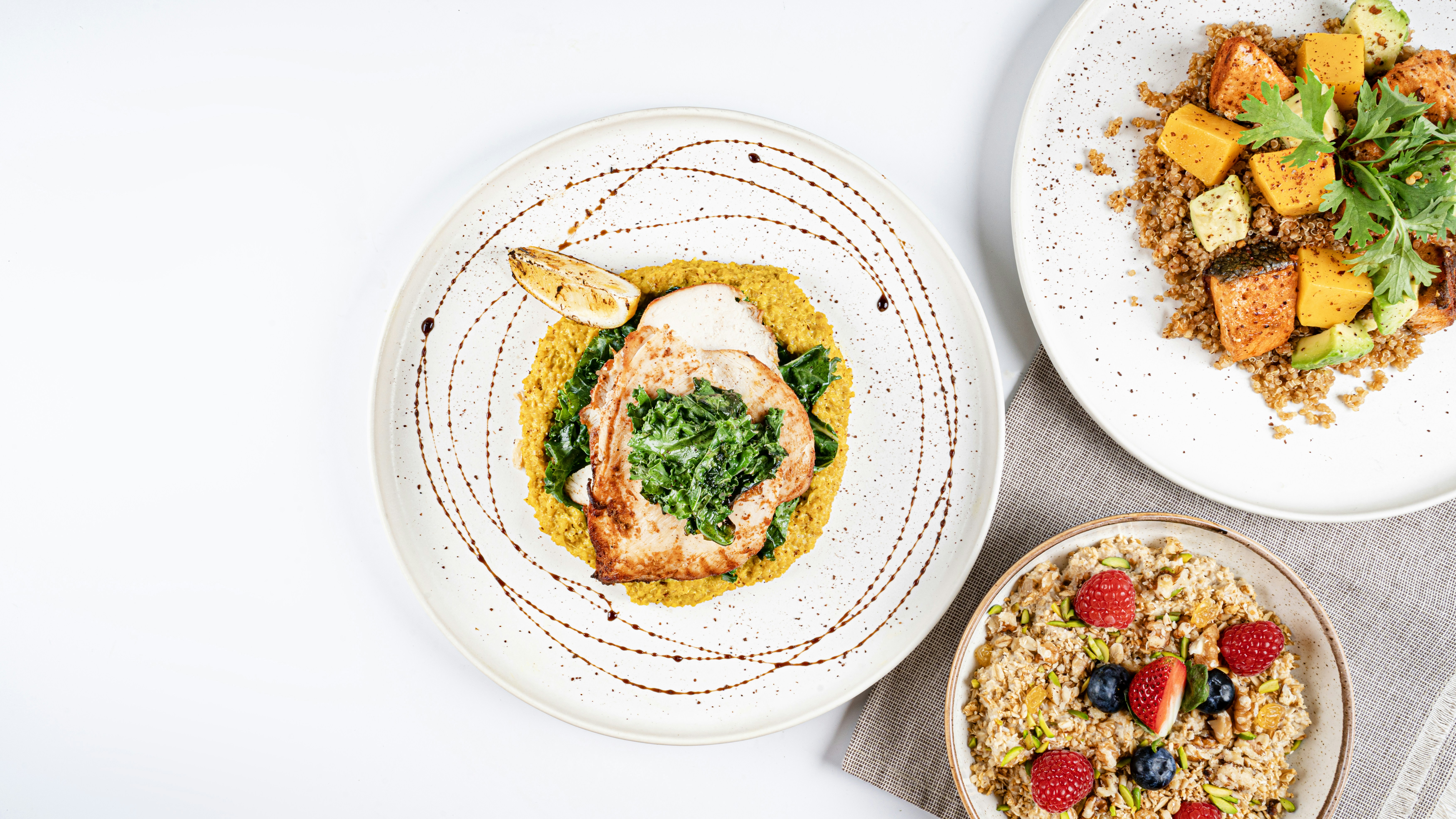 A table topped with three plates of food photo – Free Food Image on ...