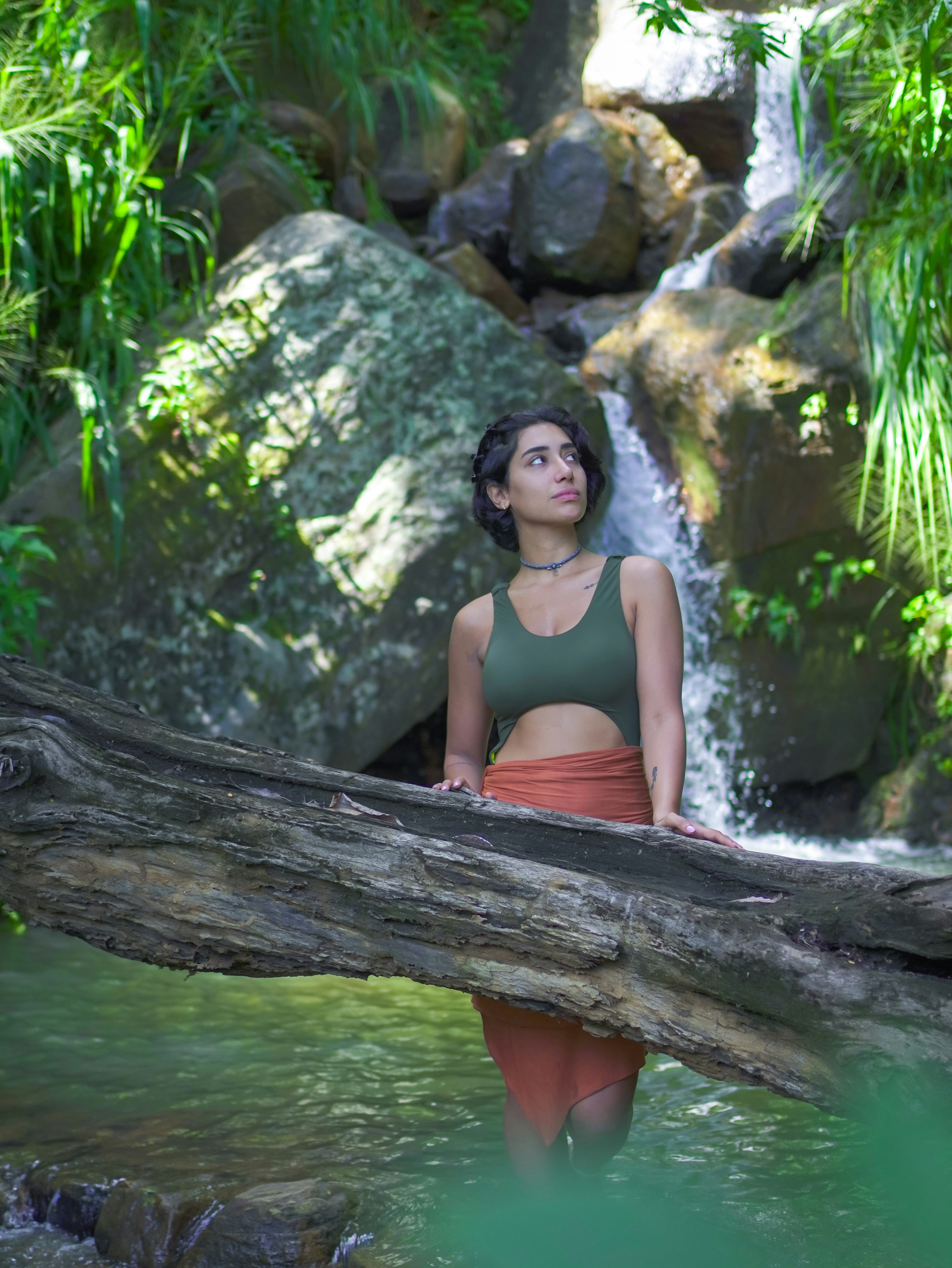 Portrait by a Jungle Cascade: Green Light, Quiet Confidence