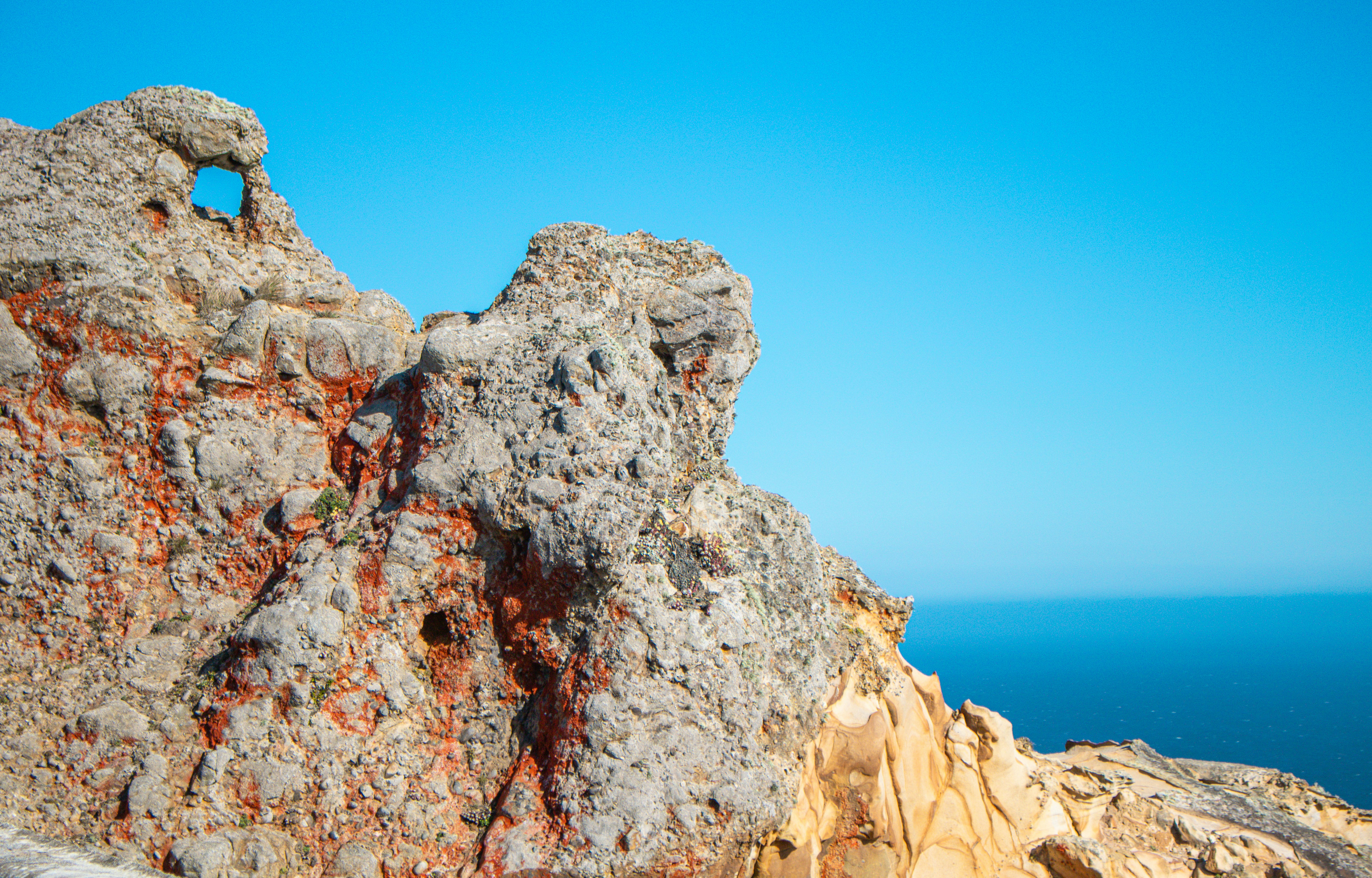 Coastal Cliff Portrait: A Weathered Arch Guarding the Horizon