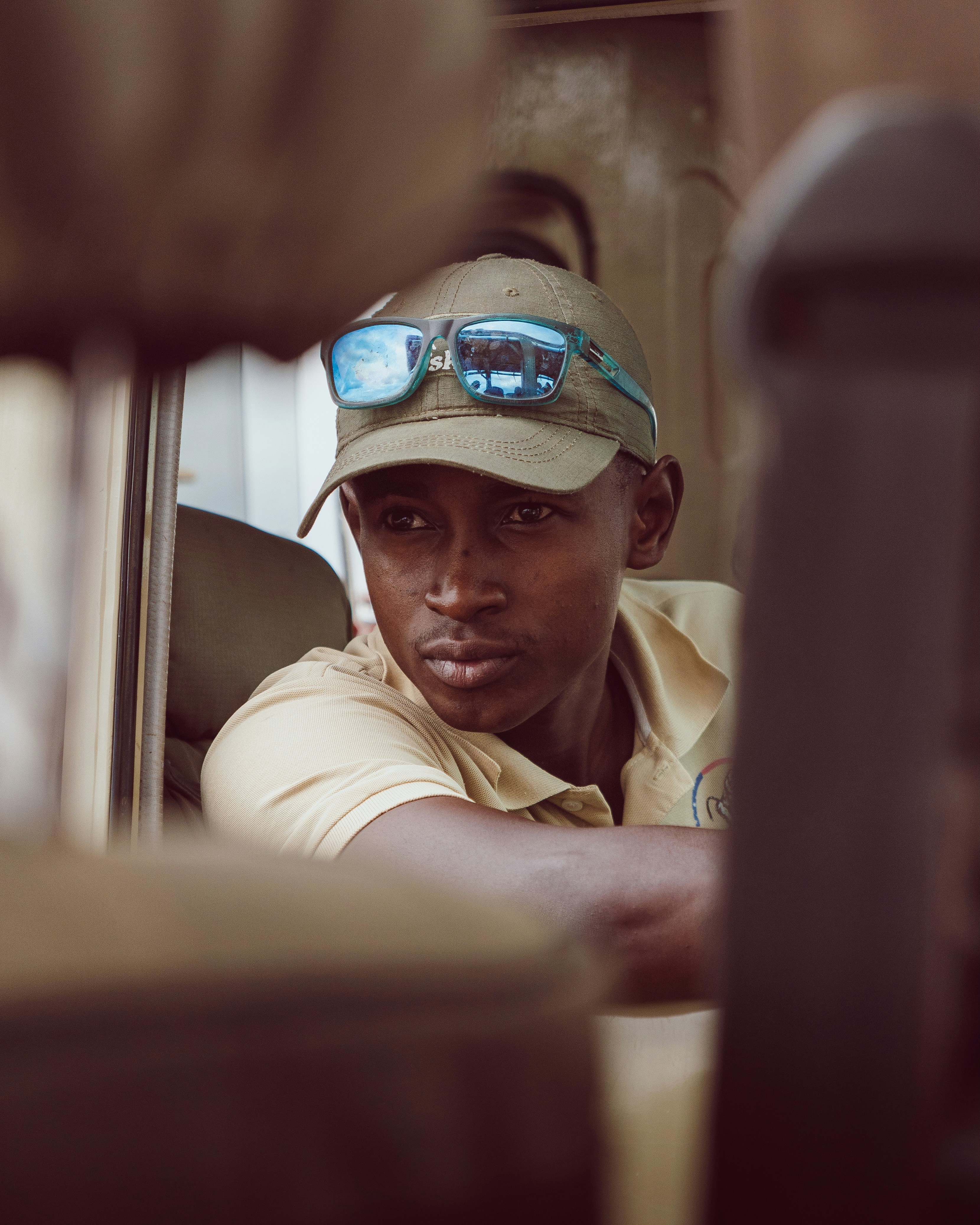 Gaze Through the Window: A Quiet Moment in a Sunlit Cab