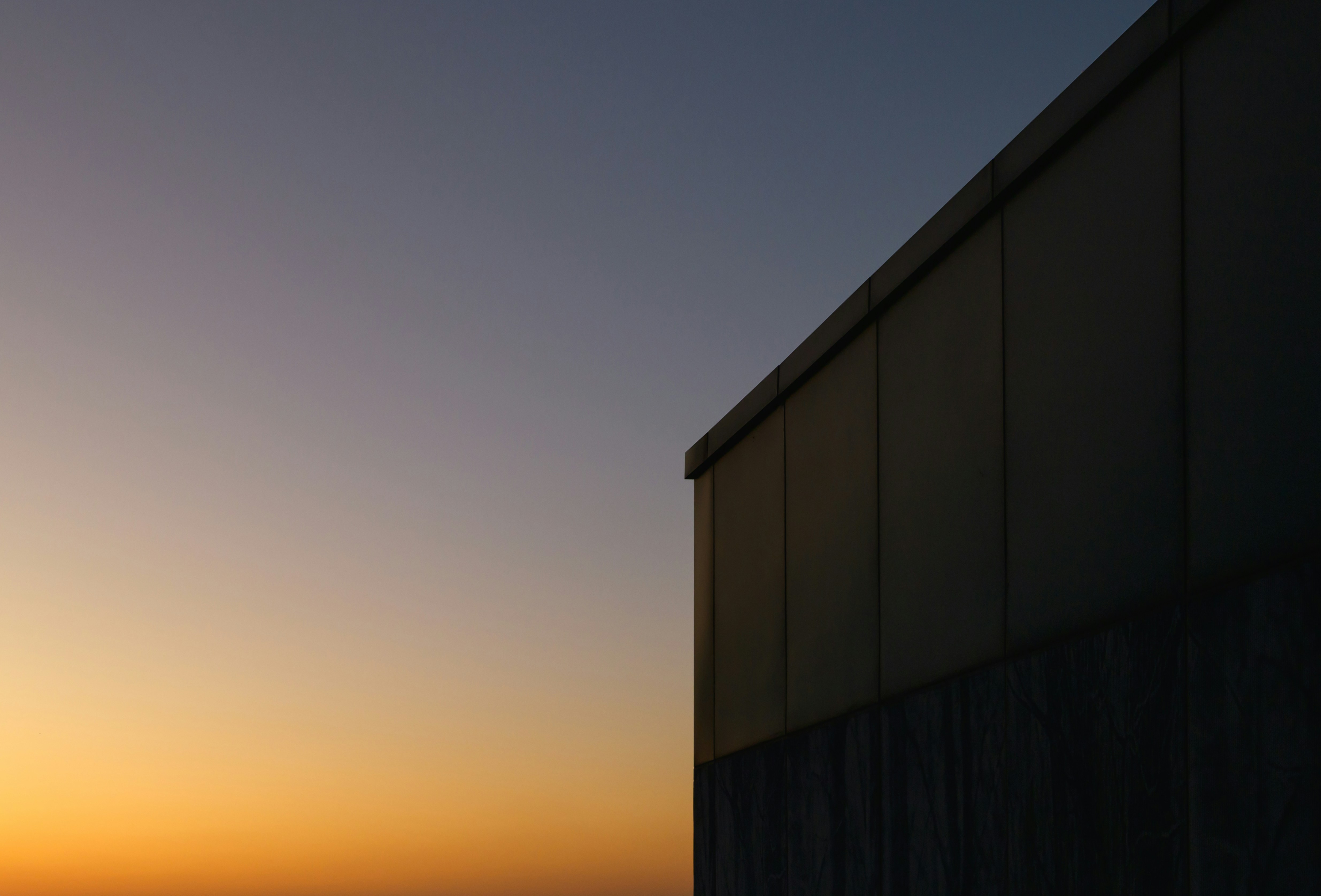 Sunset Edge: The Quiet Geometry of a Rooftop Wall