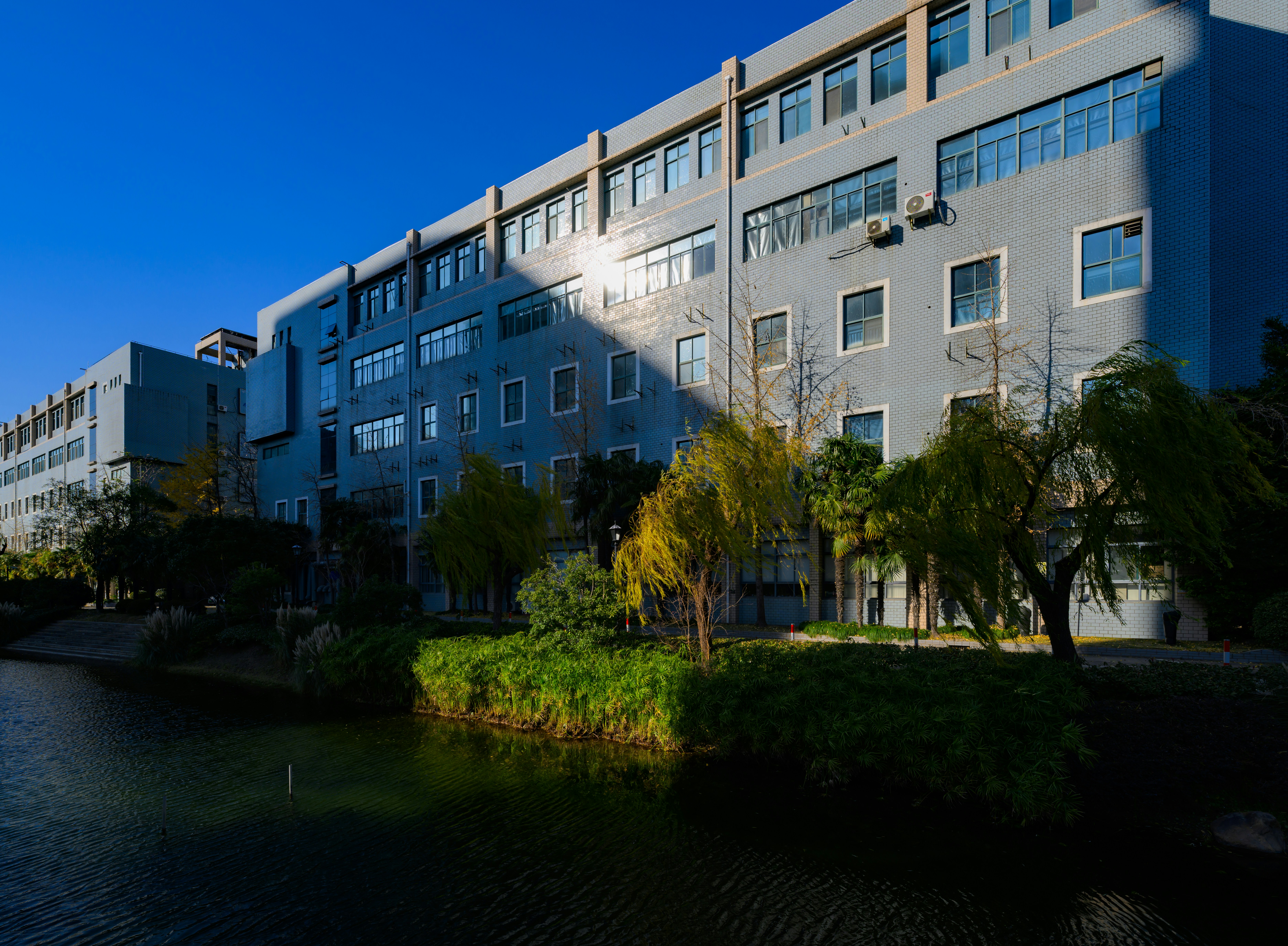 A large building next to a body of water