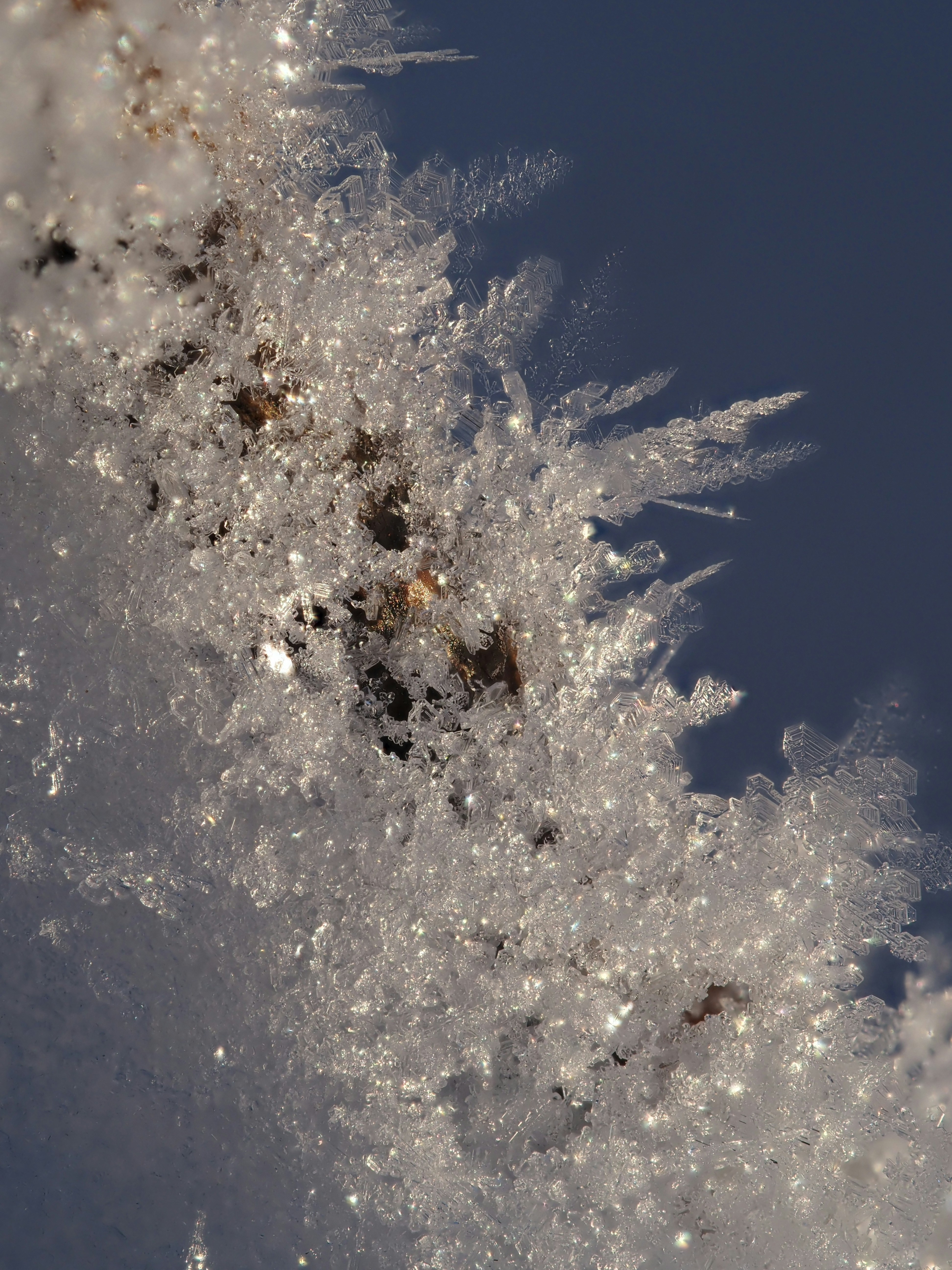 Ice Lace in Morning Light: Close-Up of Frost Crystals on Snow