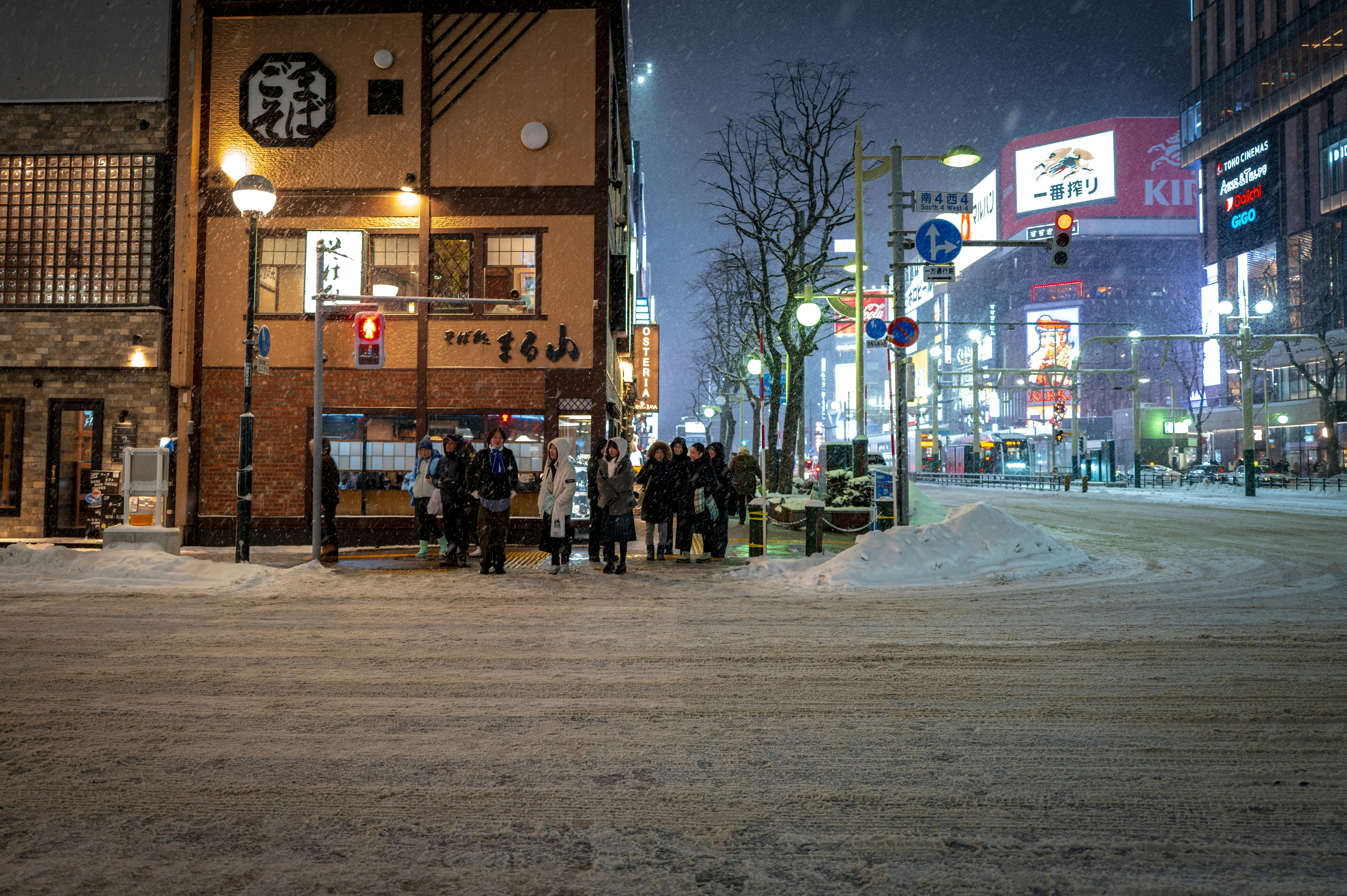 A group of people standing outside of a building photo – Free Minami 4 ...