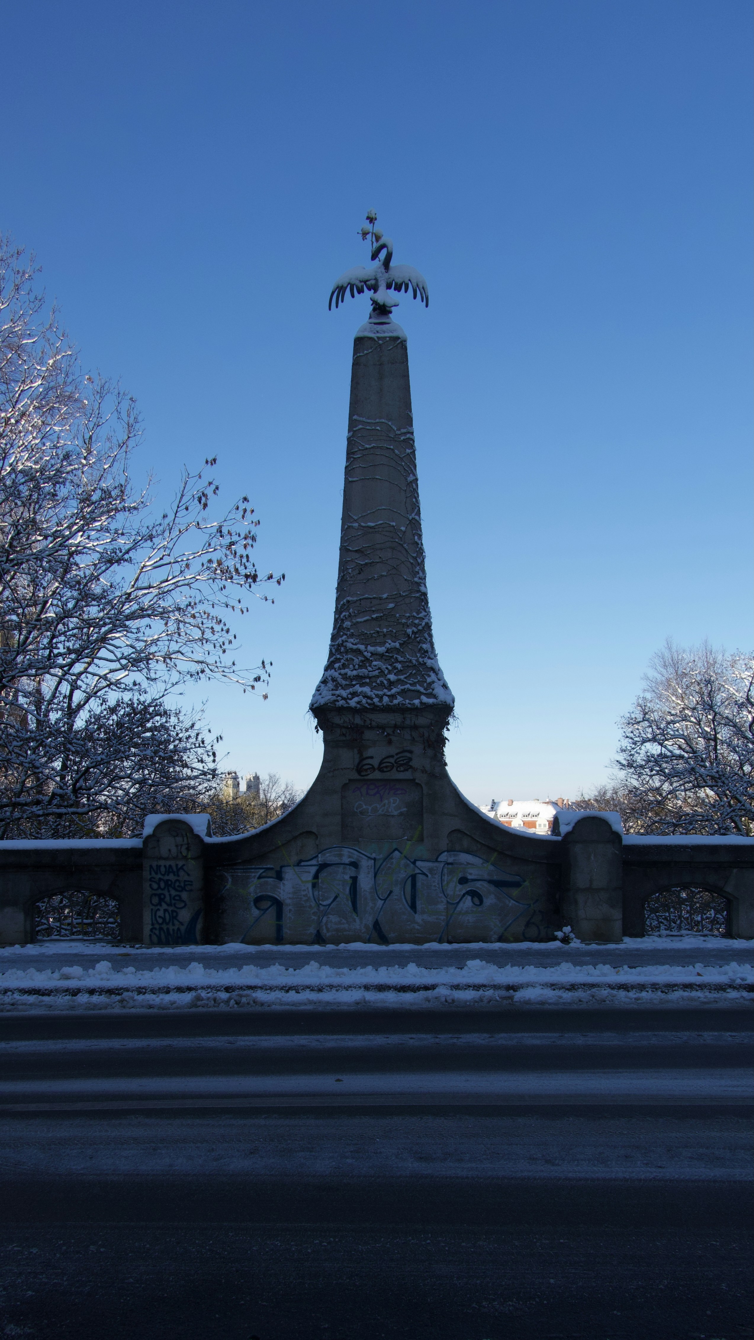 Winter Crown on a Snow-Laced Spire: A Monument Reaching Toward a Pristine Blue Sky