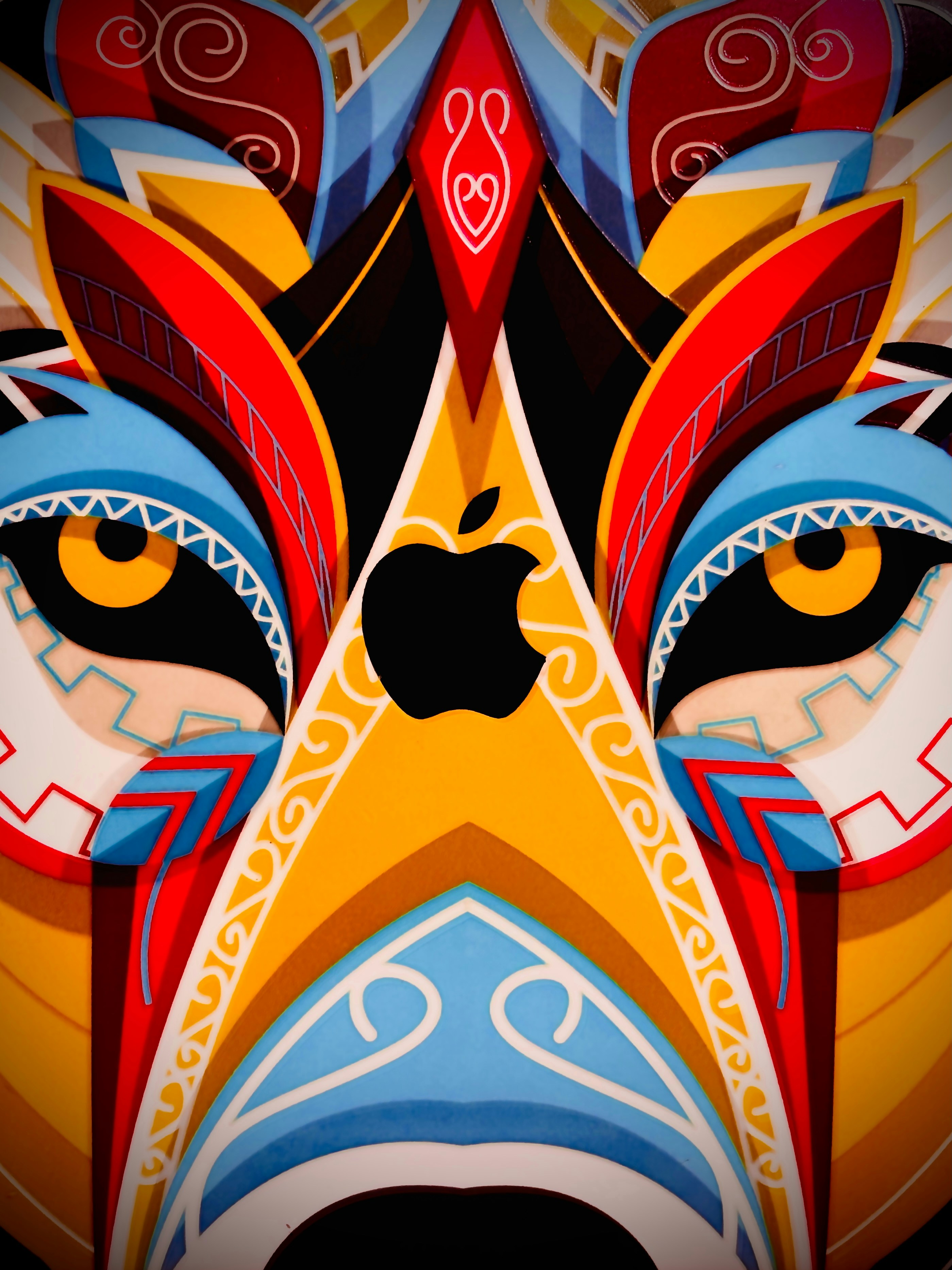 Apple at the Heart of a Kaleidoscopic Mask Mosaic