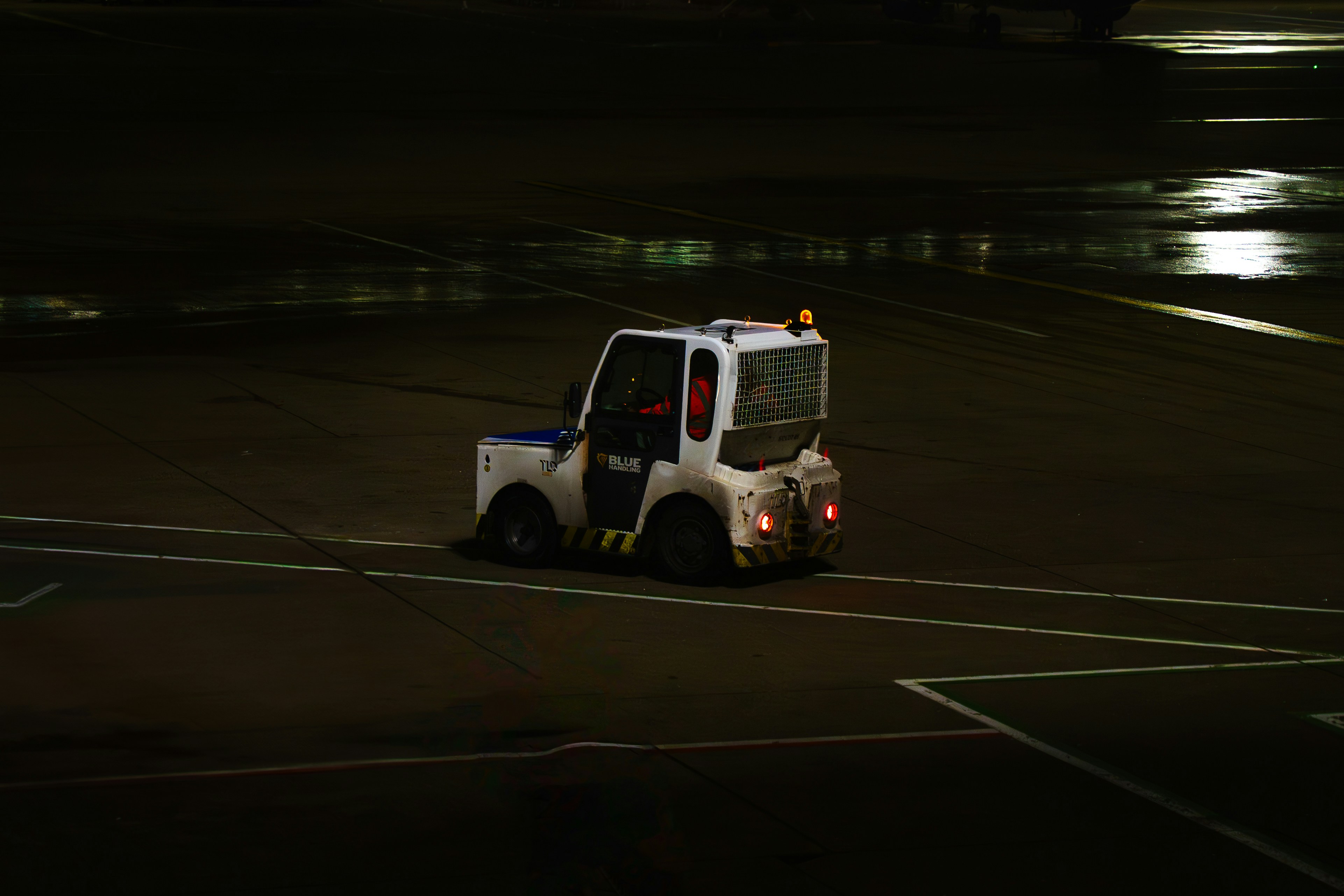 Night Ground Support Tug in Dim Airport Apron Lights