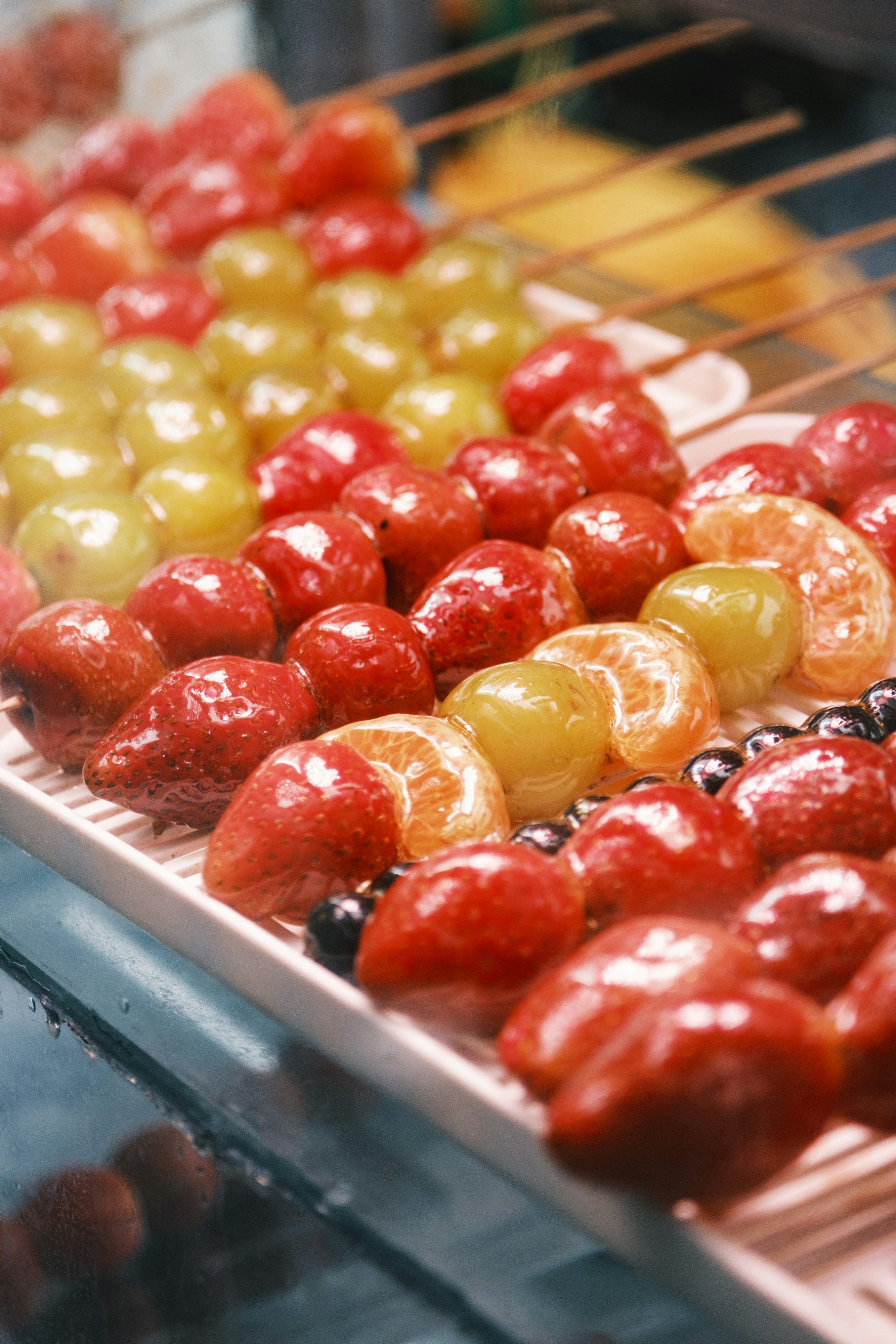 Rainbow Glaze: Candied Fruit Skewers on a Market Tray
