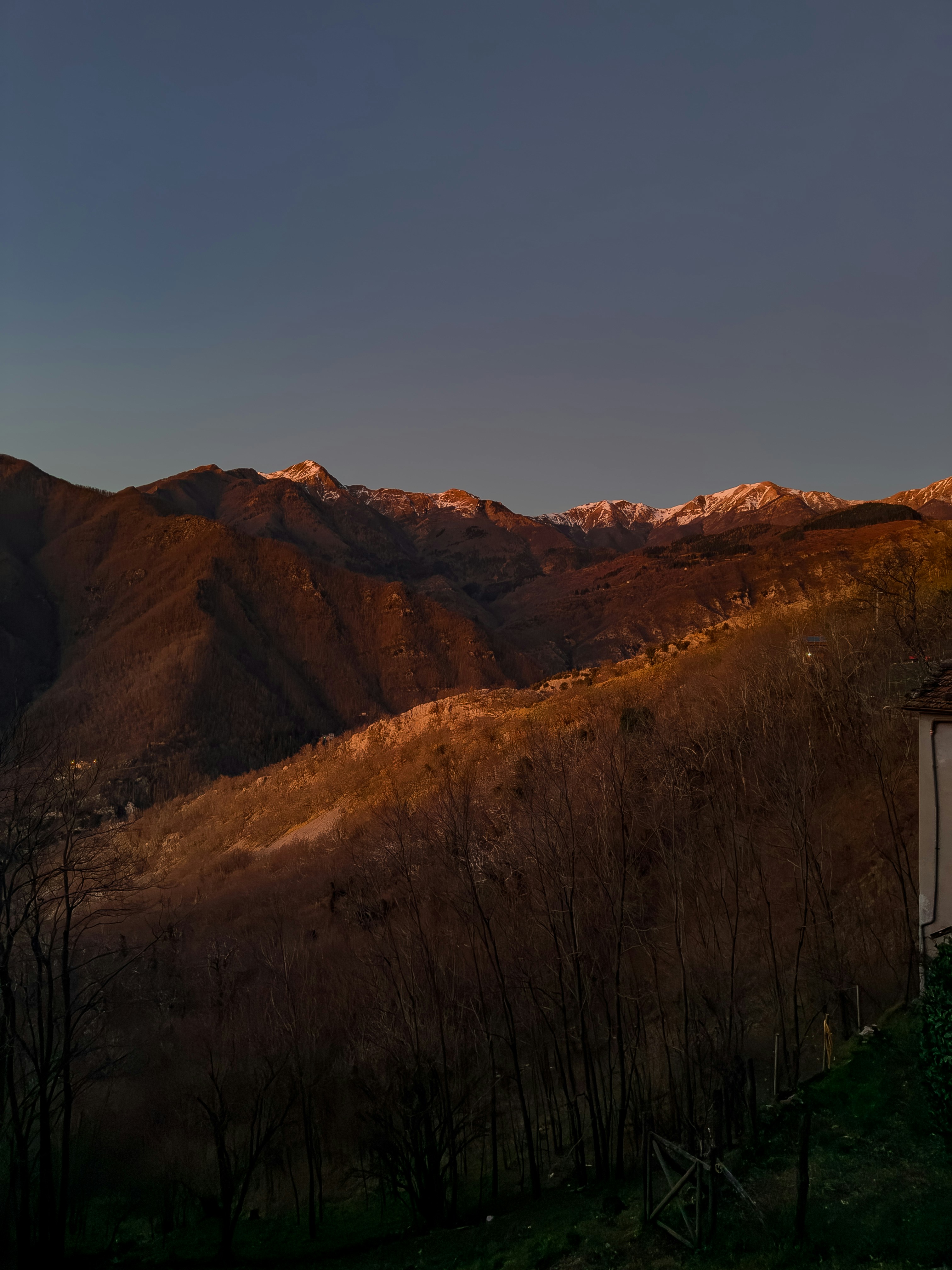Dusk Cliffs: Golden Hour on a Snow-Kissed Ridge