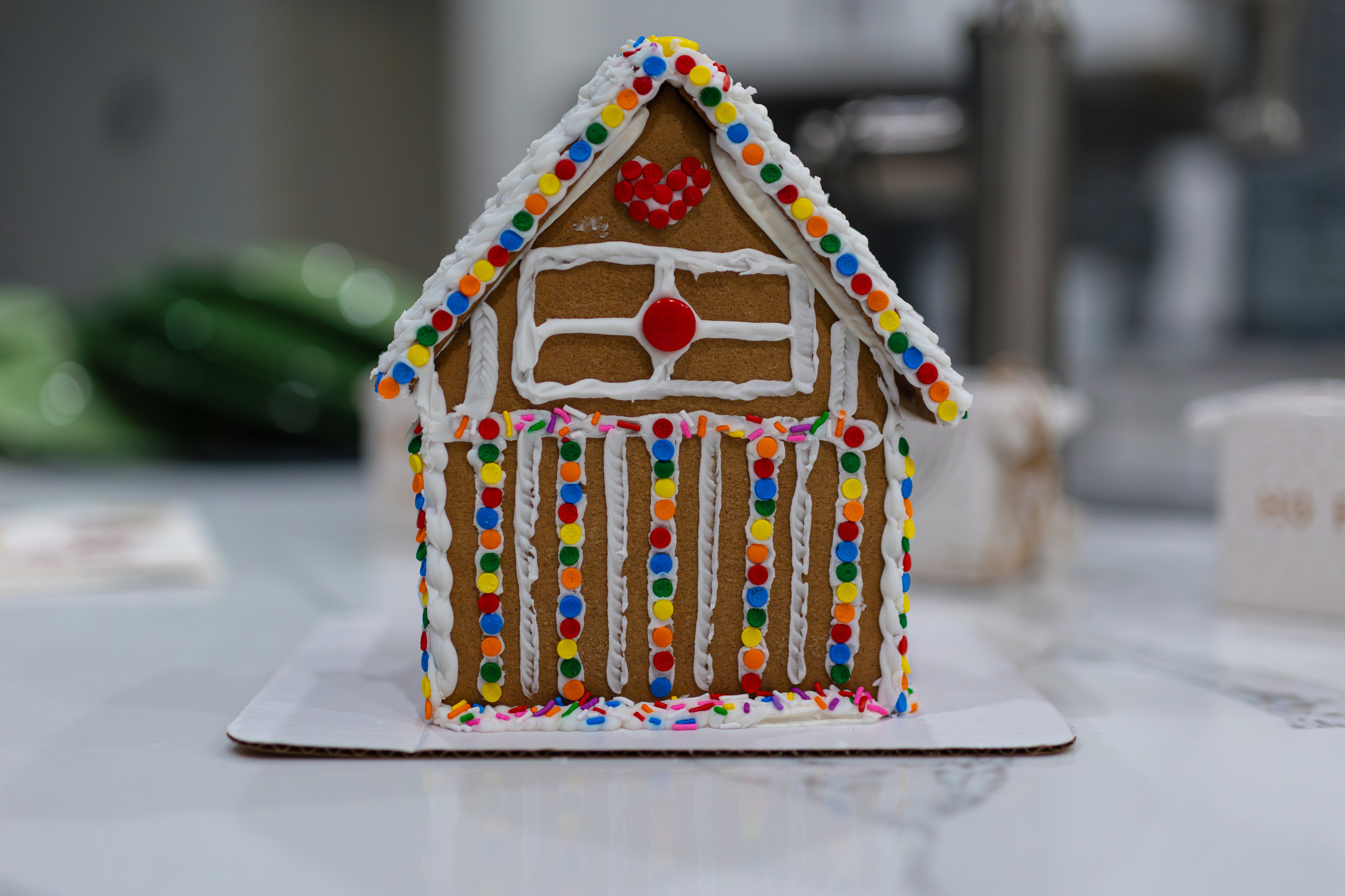 Candy-Trimmed Gingerbread House on a Quiet Studio Counter