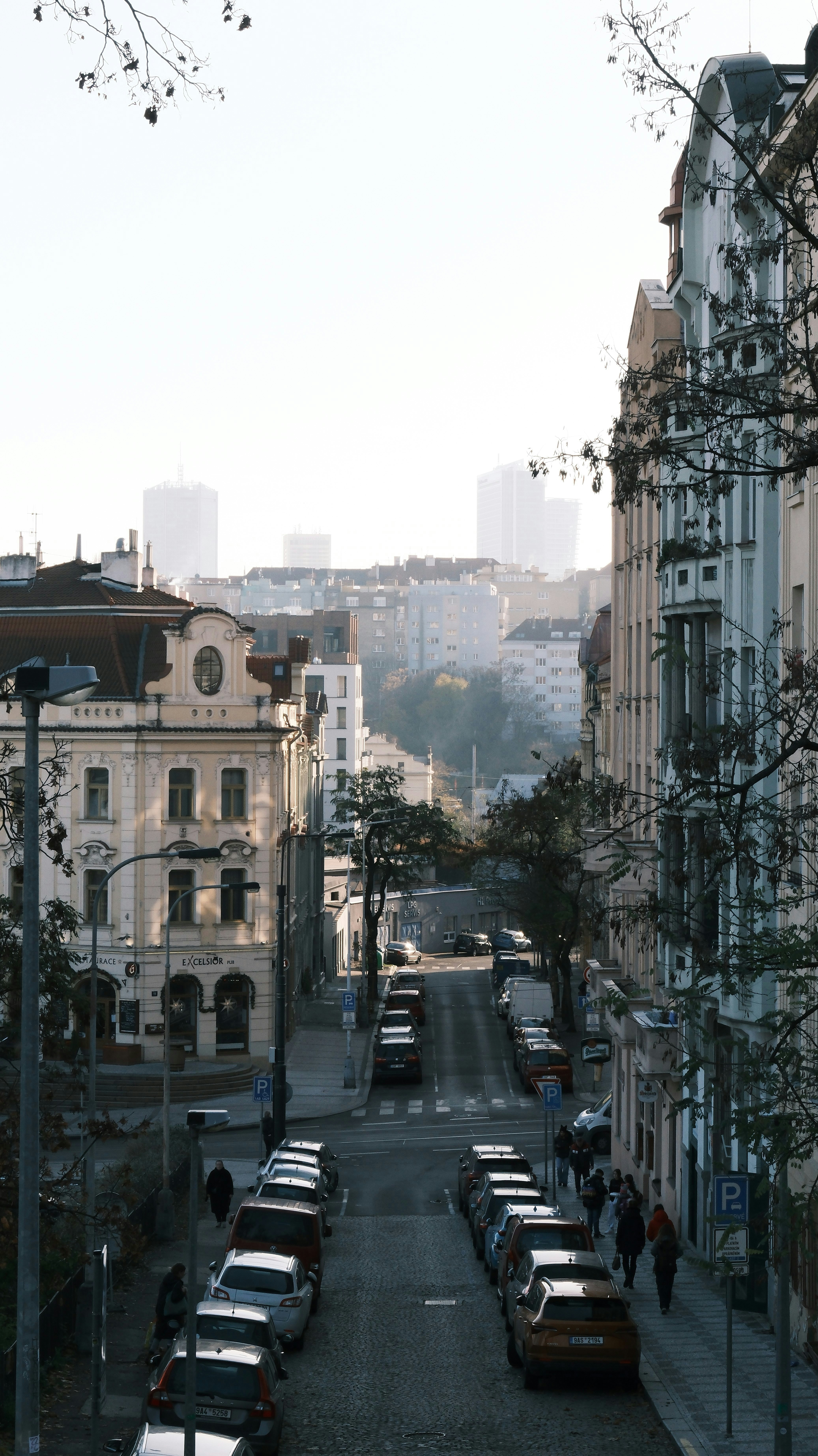 Charming European Street View with Classic Architecture and Modern Skyline