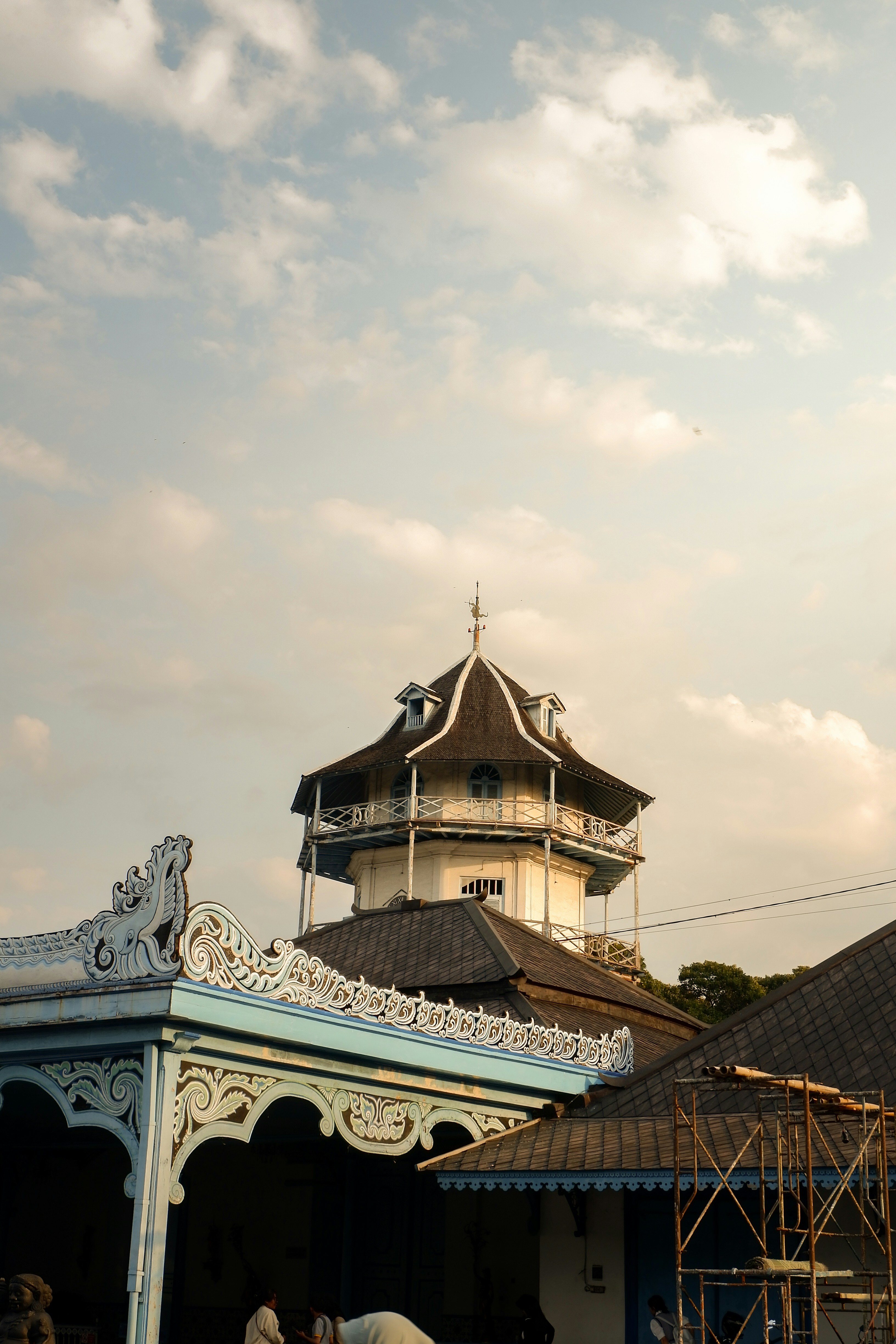 Timber Watchtower Framed by Ornate Blue Eaves in Quiet Afternoon Light