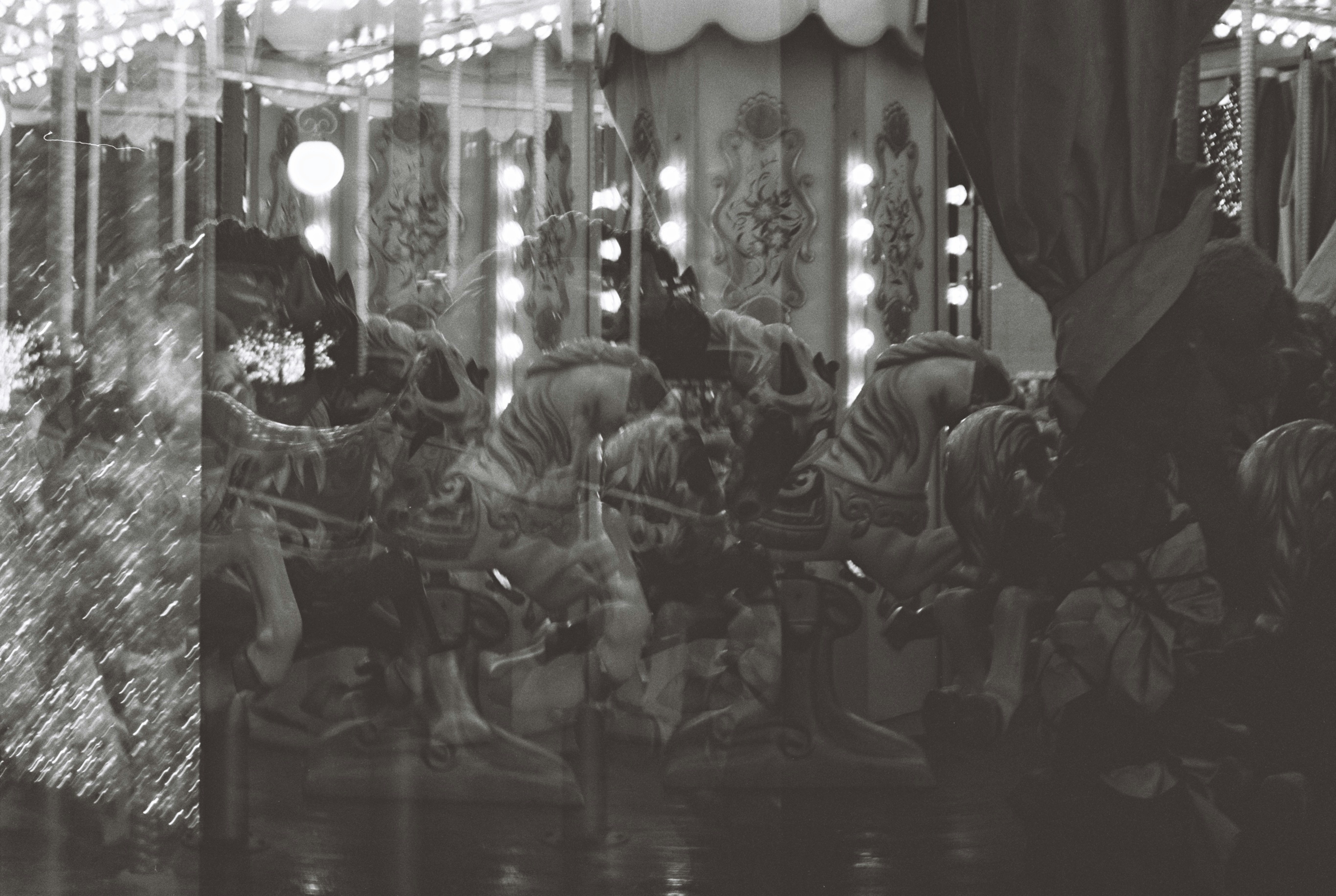 A black and white photo of a merry go round photo – Free Photography ...