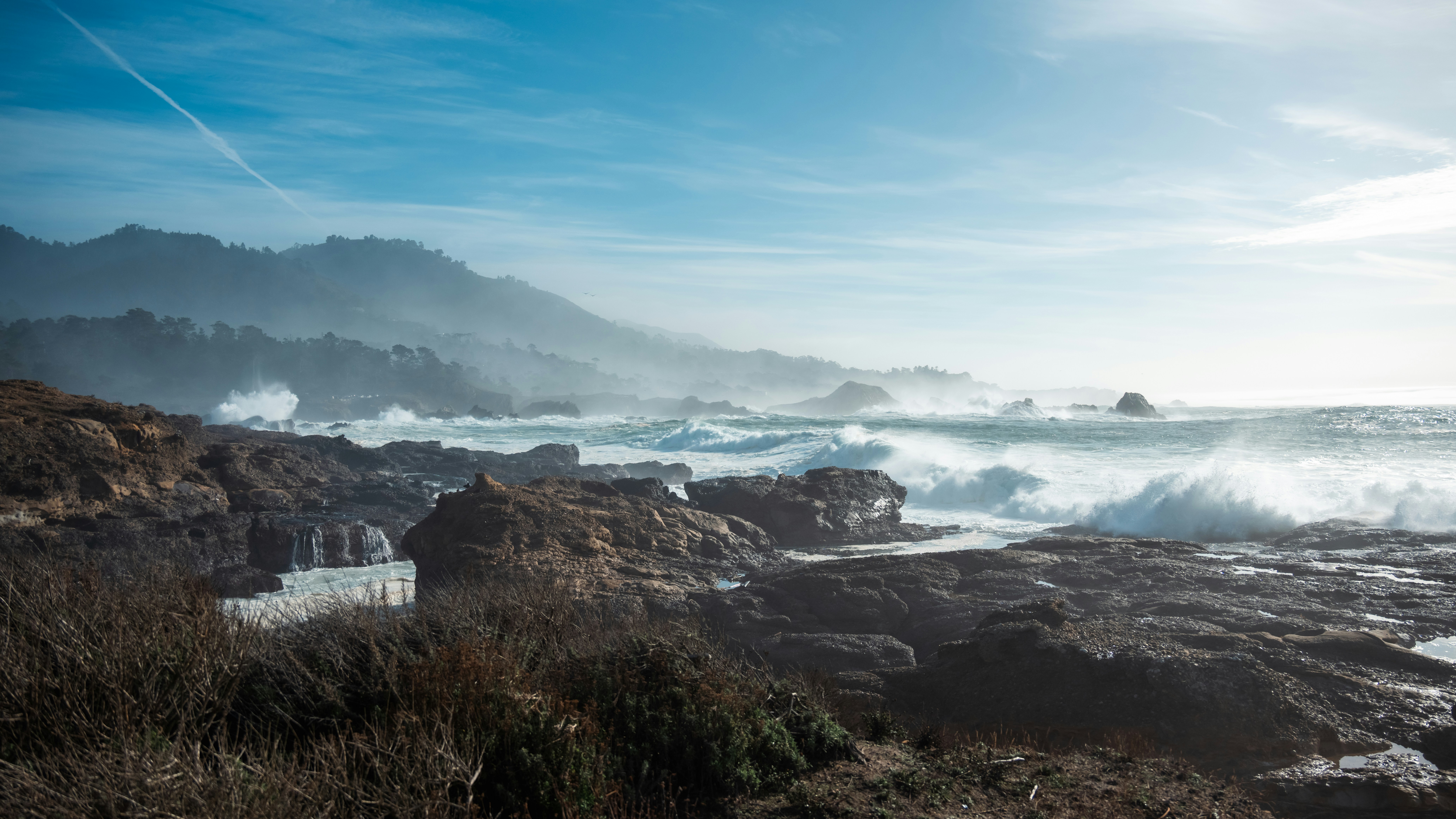 A rocky beach with waves crashing on the shore photo – Free Sea Image ...