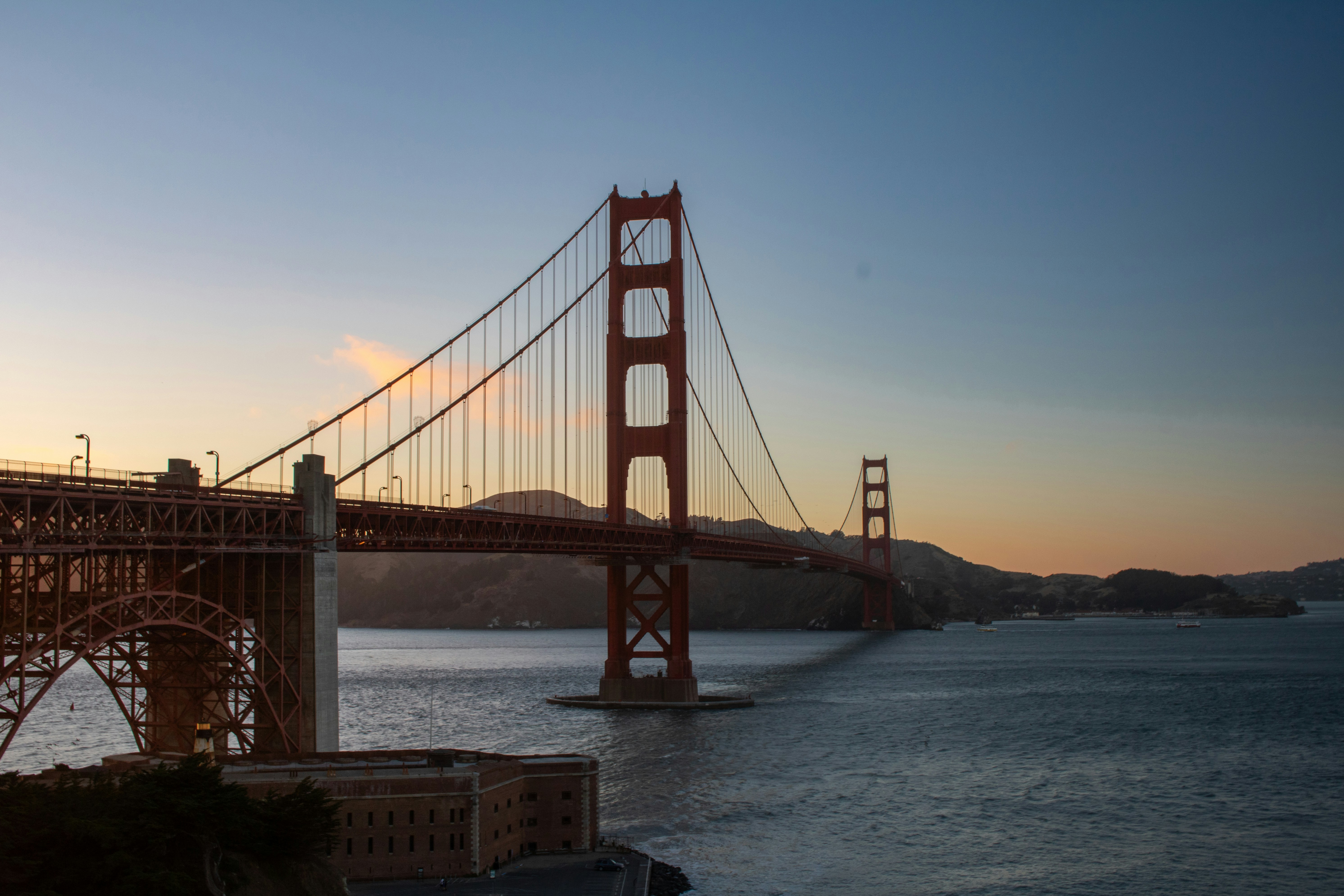 A view of the golden gate bridge at sunset photo – Free San francisco ...