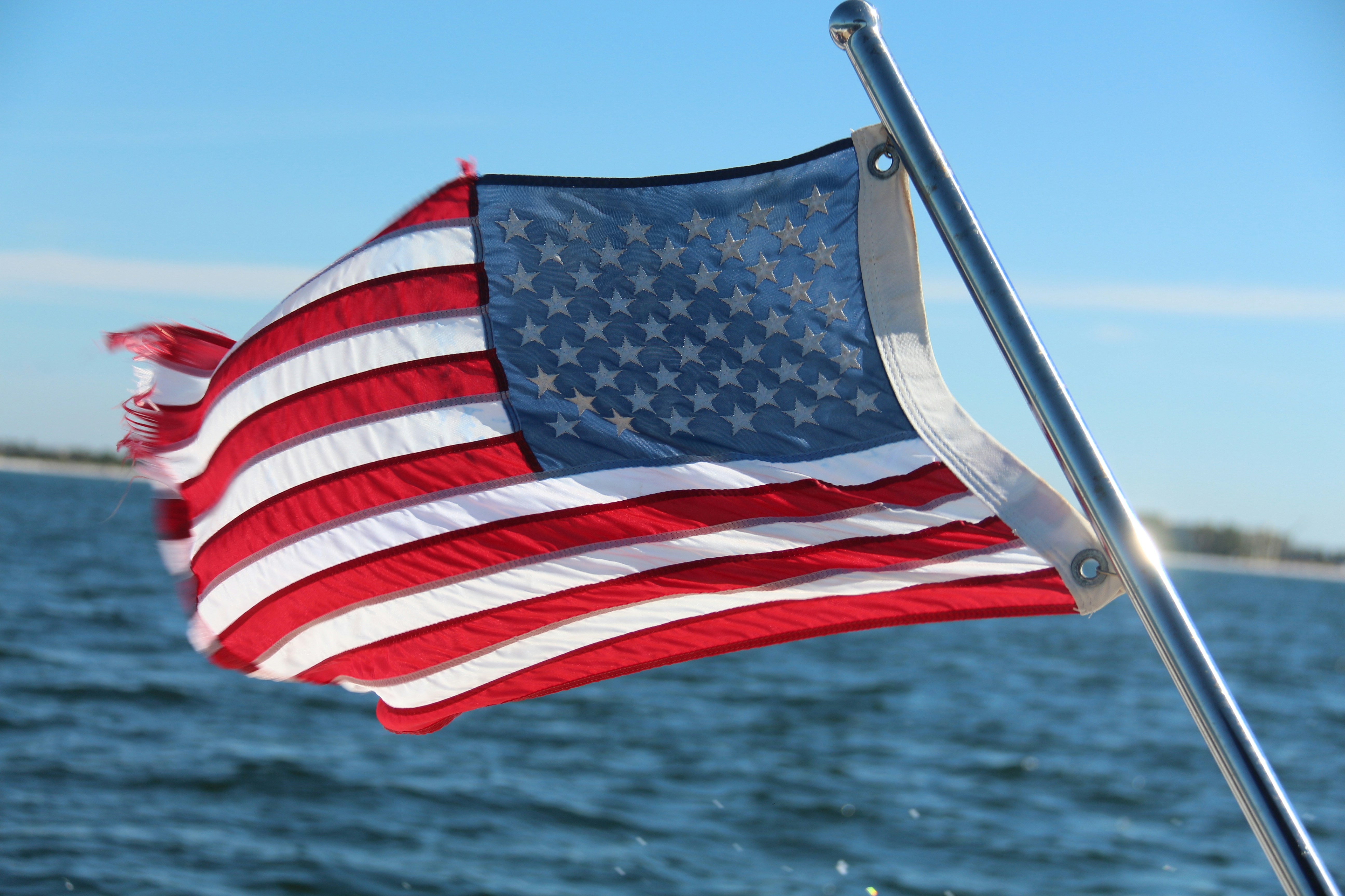 Wind-Swept Banner at Sea: The Star-Spangled Flag on a Bow