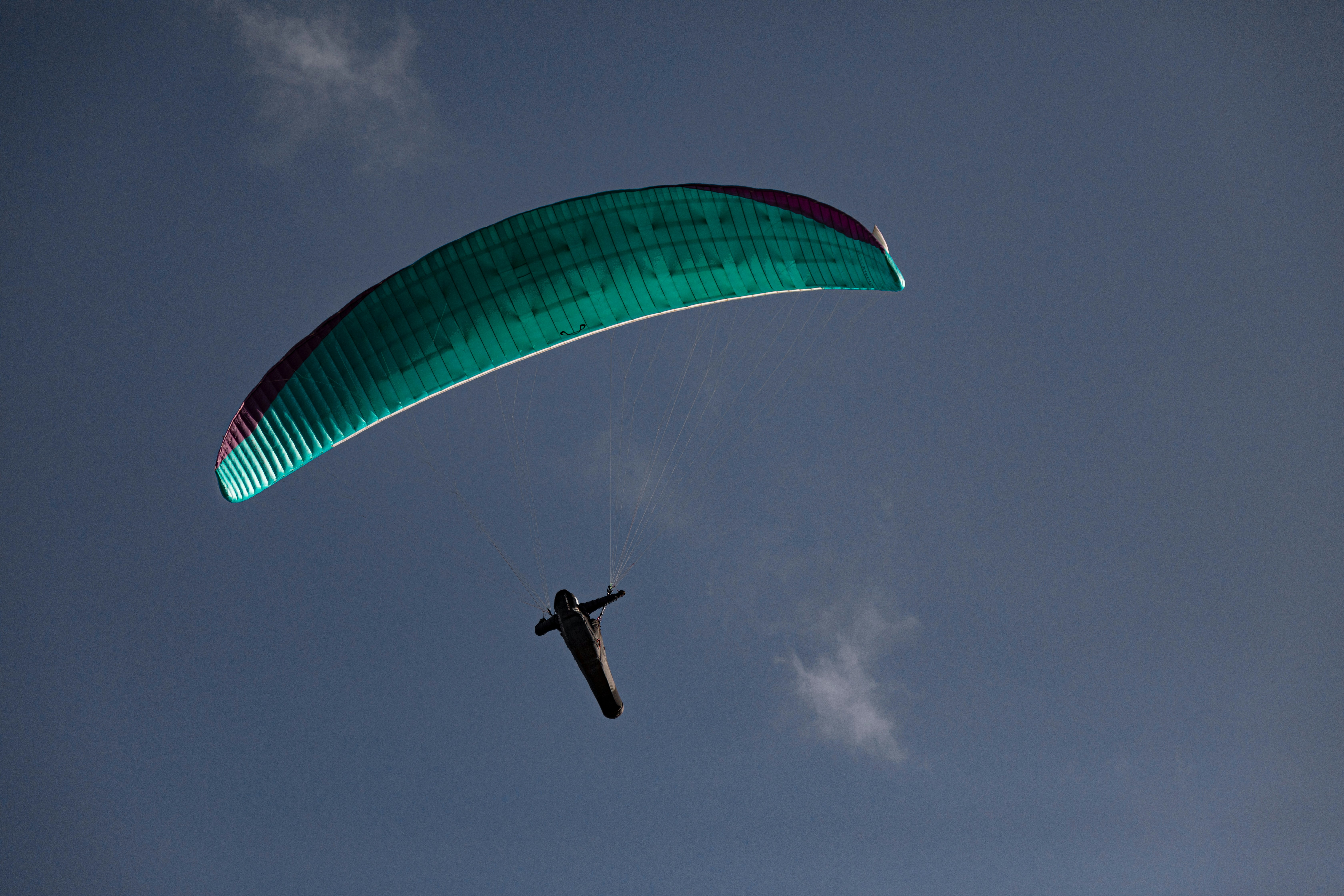 A parasailer is flying high in the sky photo – Free Faro del cabo de ...