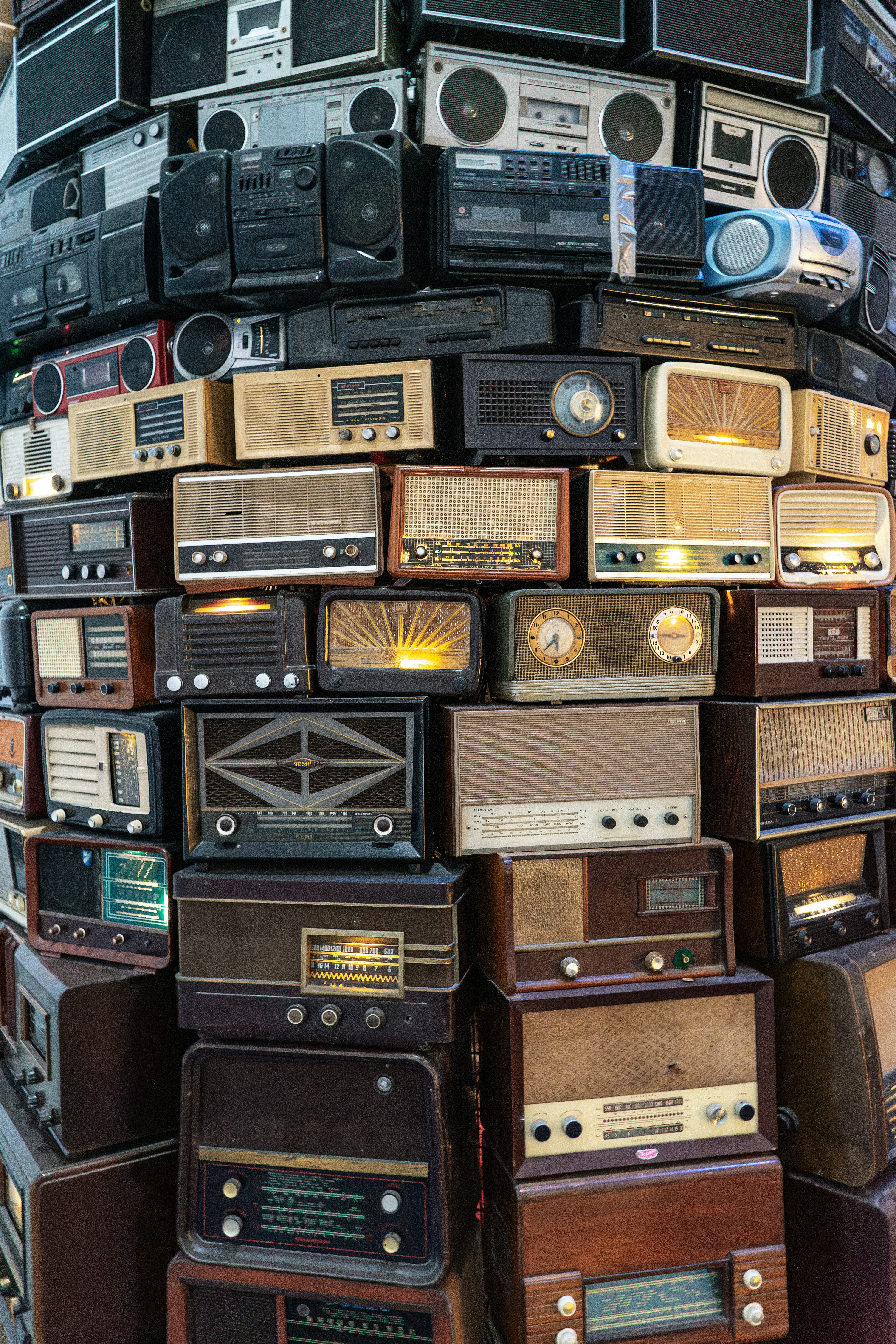 A large stack of old radio's sitting on top of each other photo – Free ...