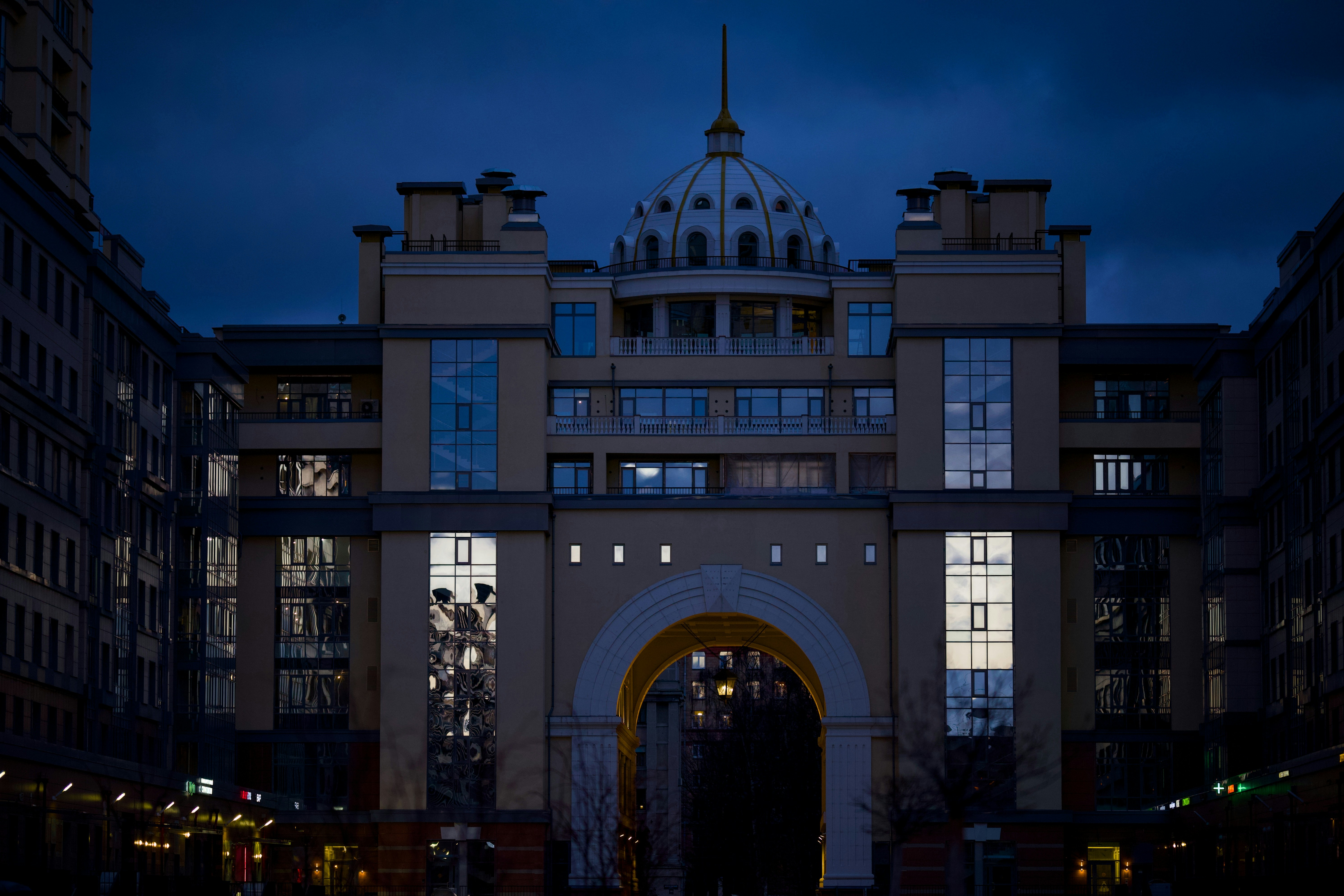A large building with a clock tower at night photo – Free Arch Image on ...