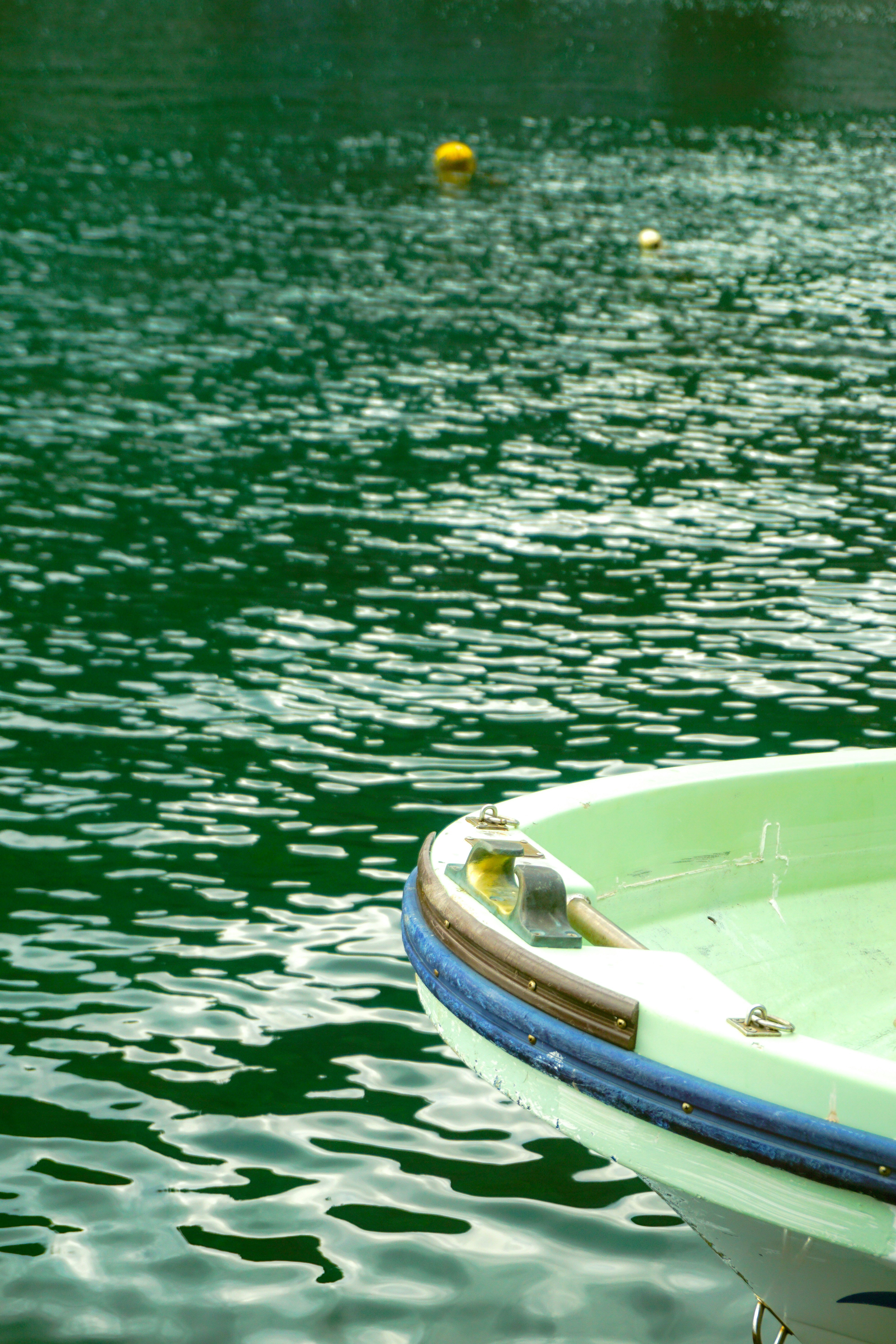 Emerald Ripples and the Bow at the Water's Edge