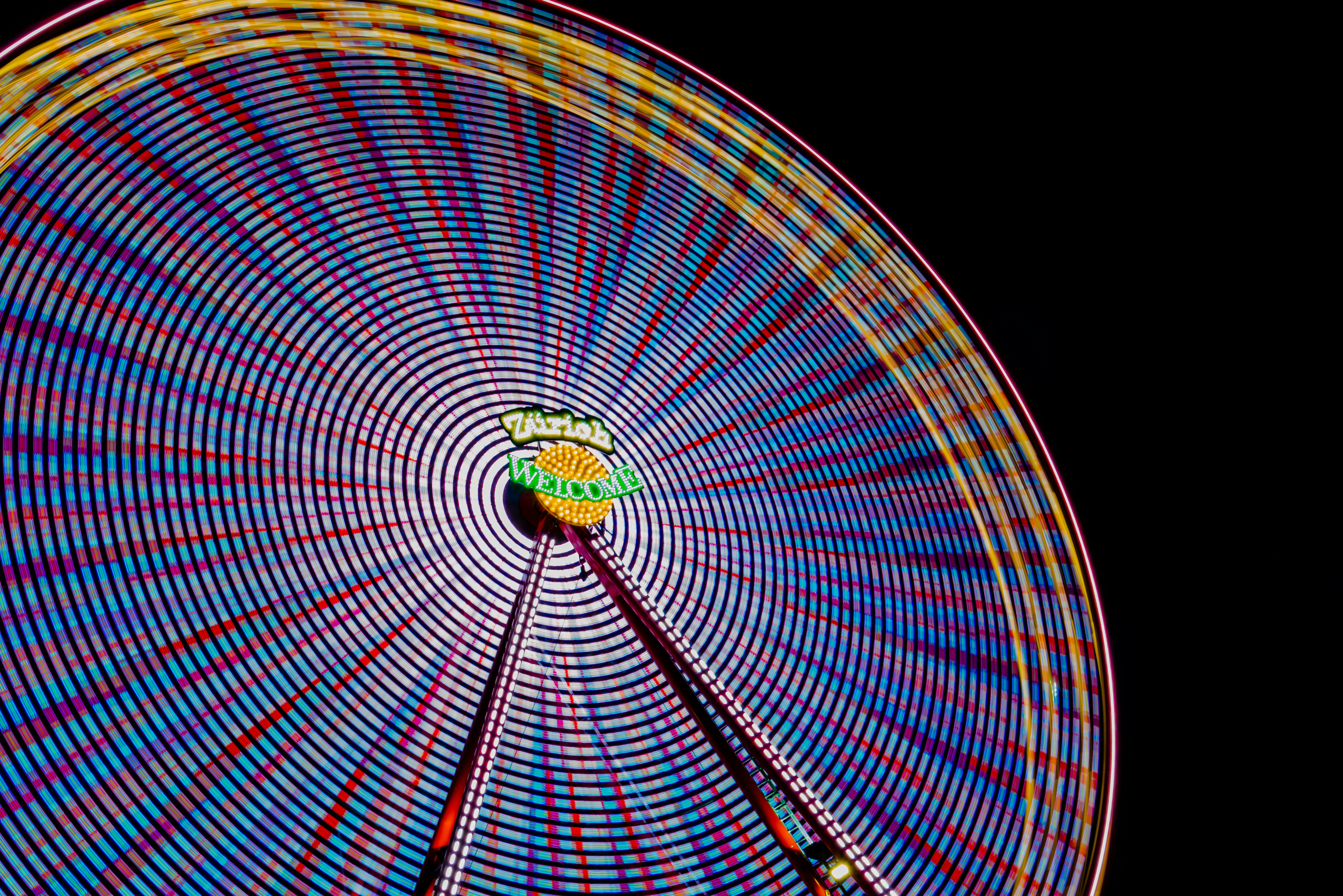 Spin of Color: The Ferris Wheel's Concentric Glow