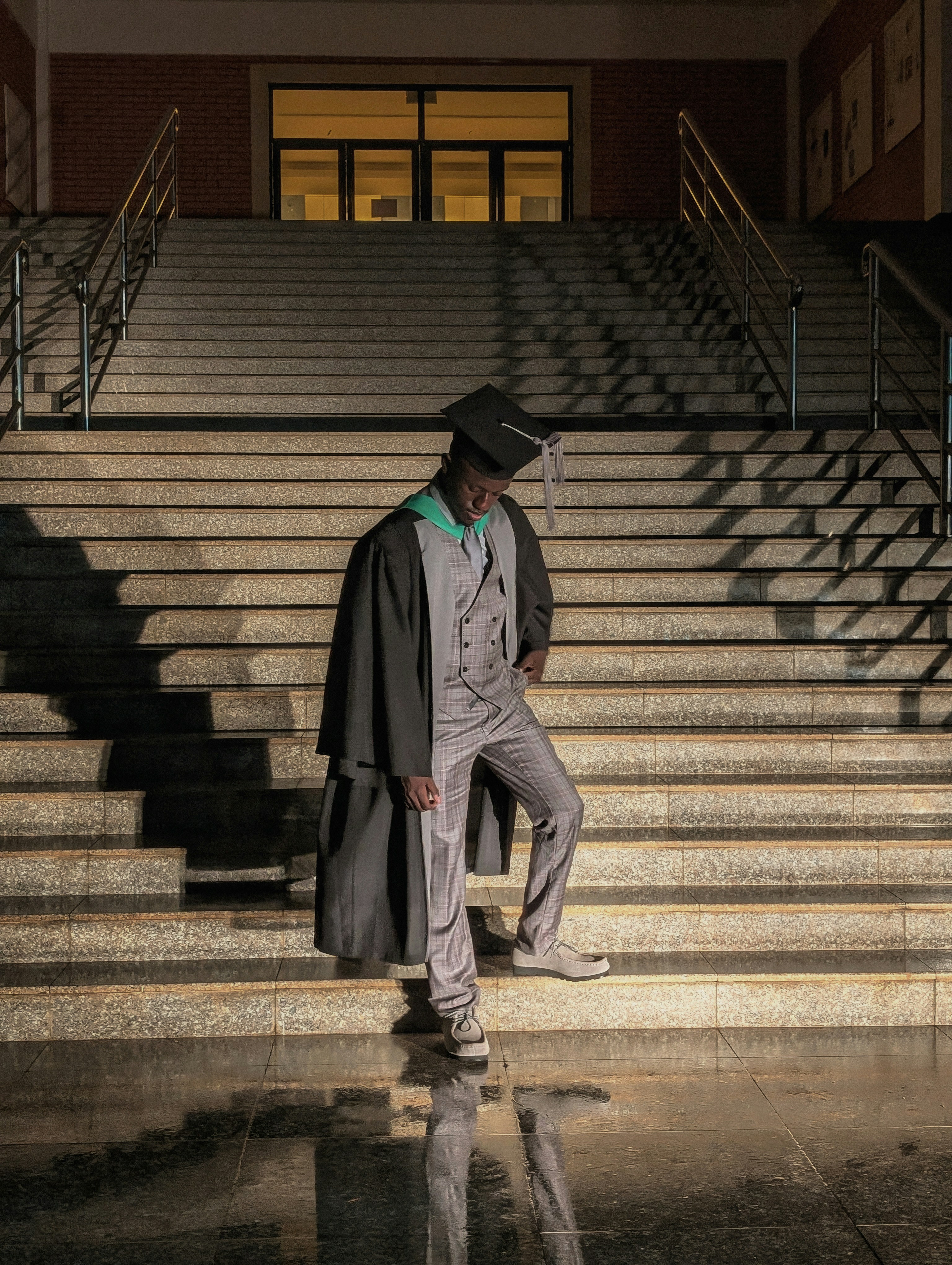 Graduation Stance on Urban Steps at Dusk