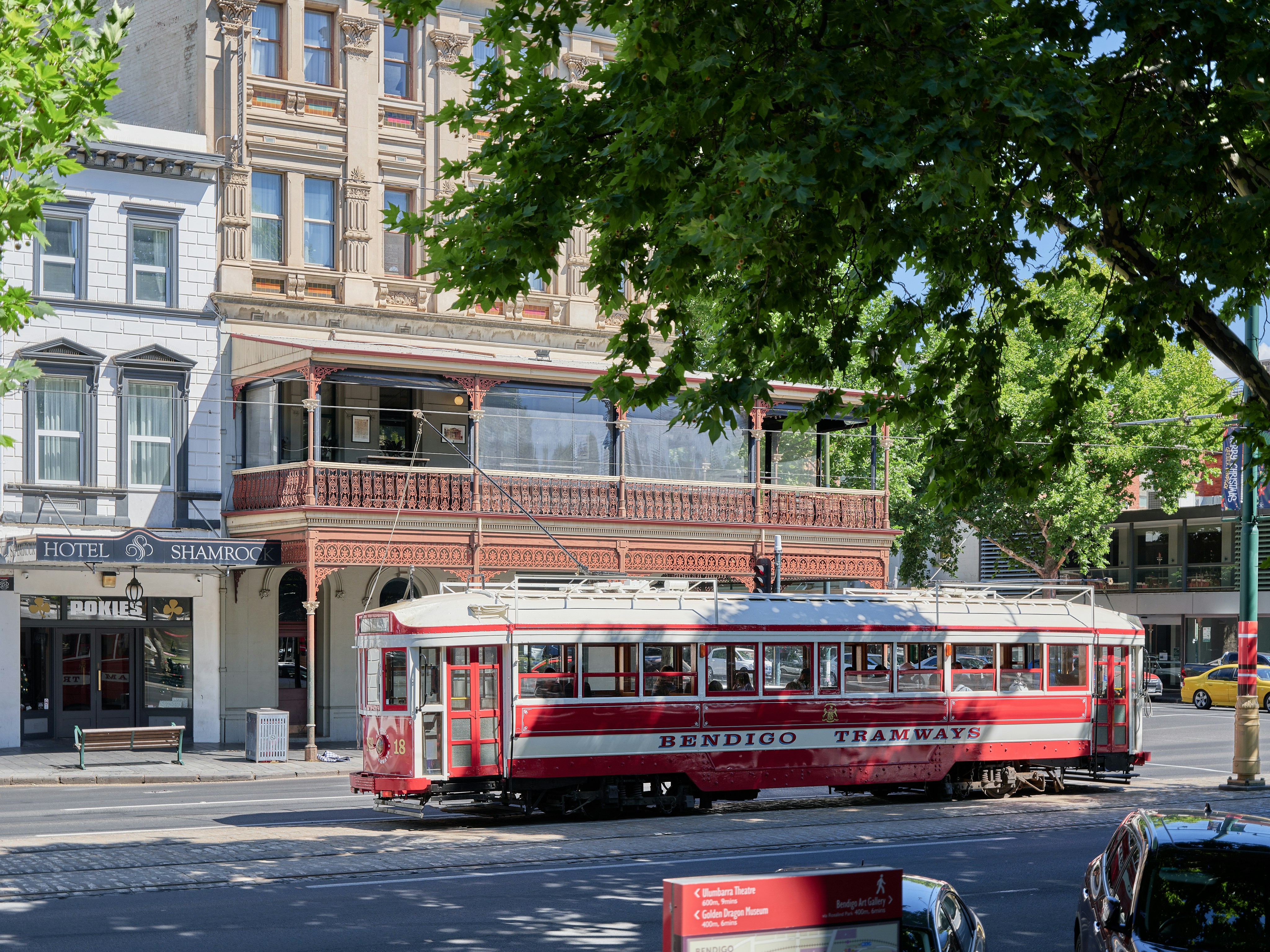 Bendigo Tram Winding Through a Sunlit Lane of Victorian Facades