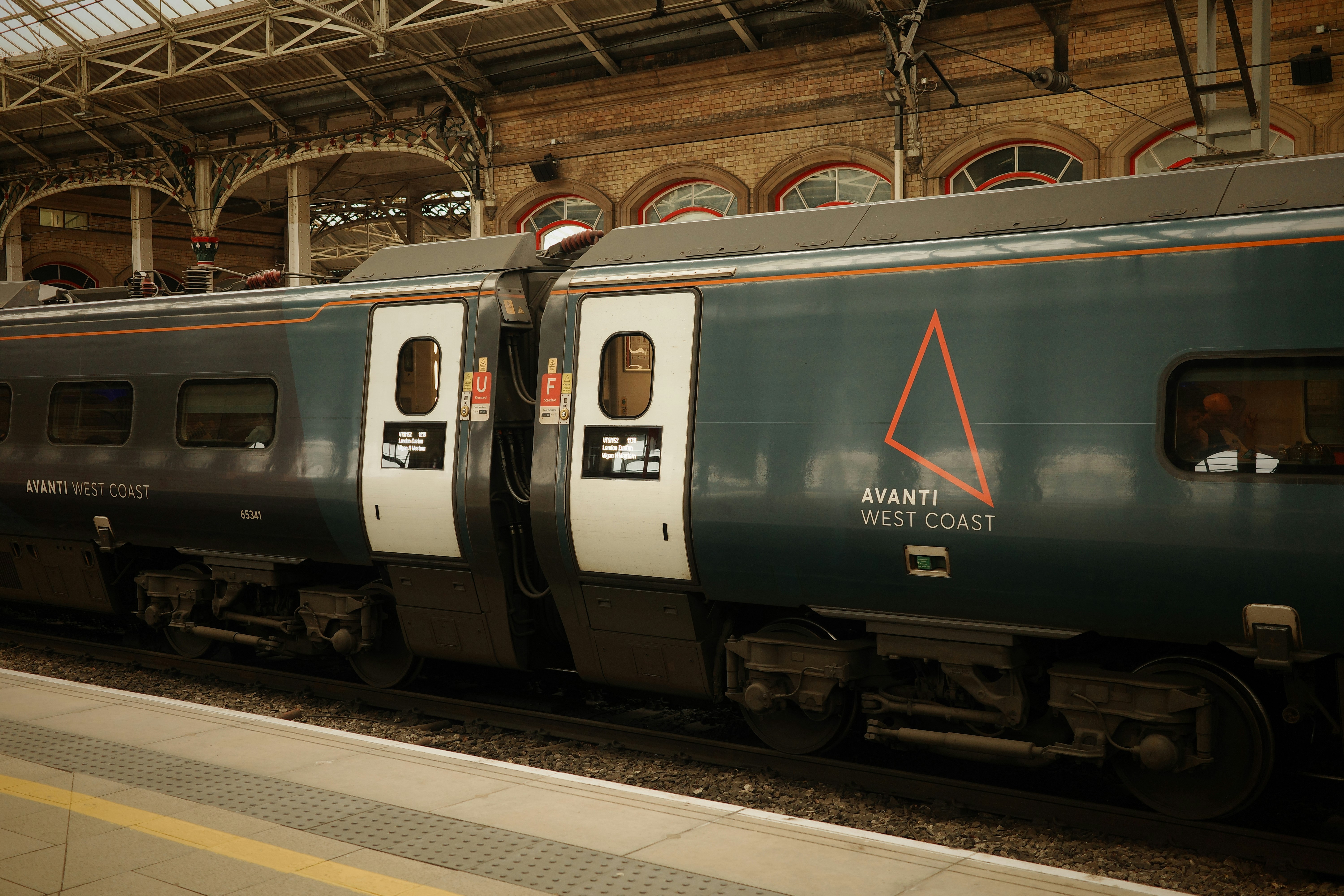 Avanti West Coast Rails Pass by: Corporate Green Livery on a Platform