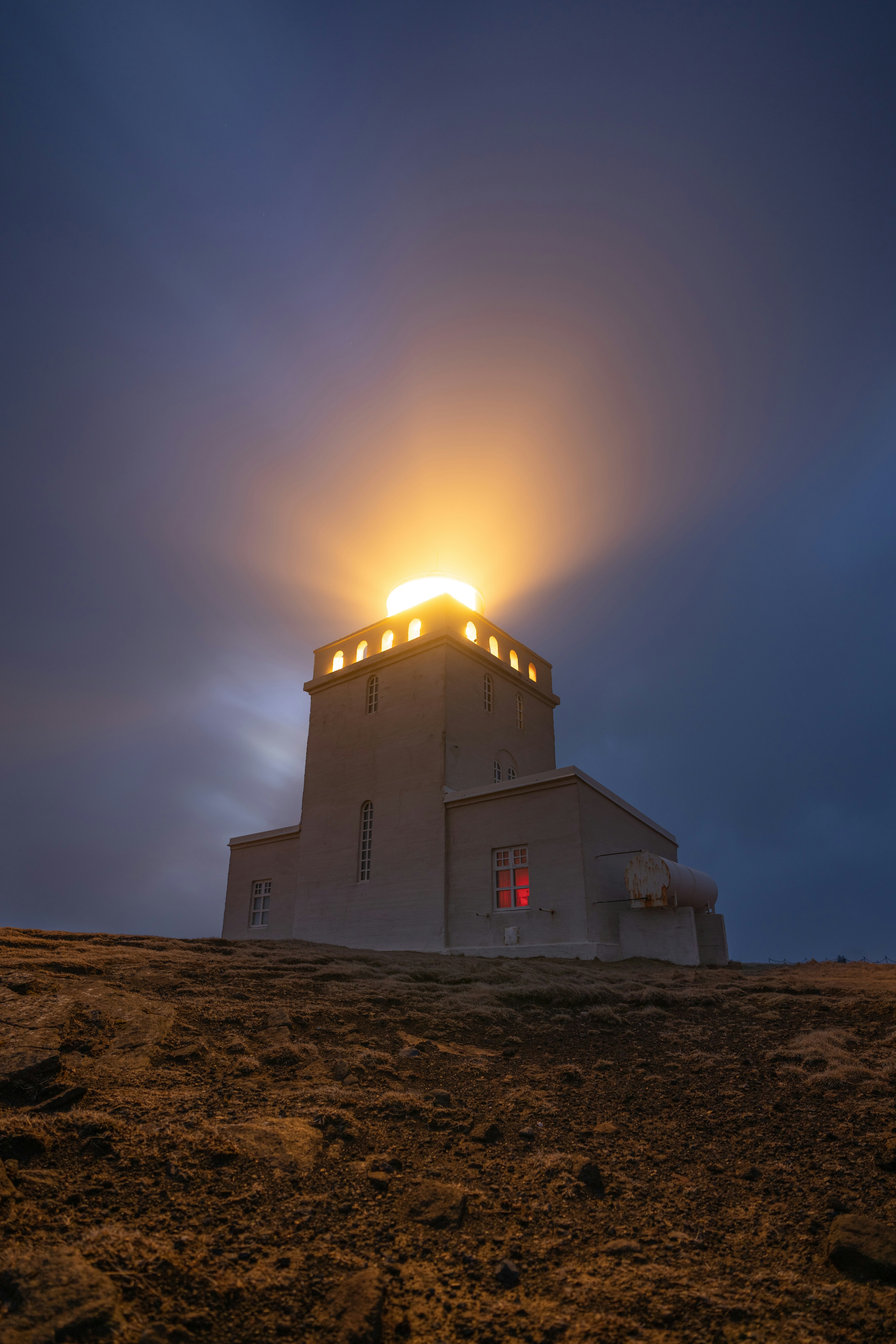 Dusk Beacon atop a solitary coastal lighthouse