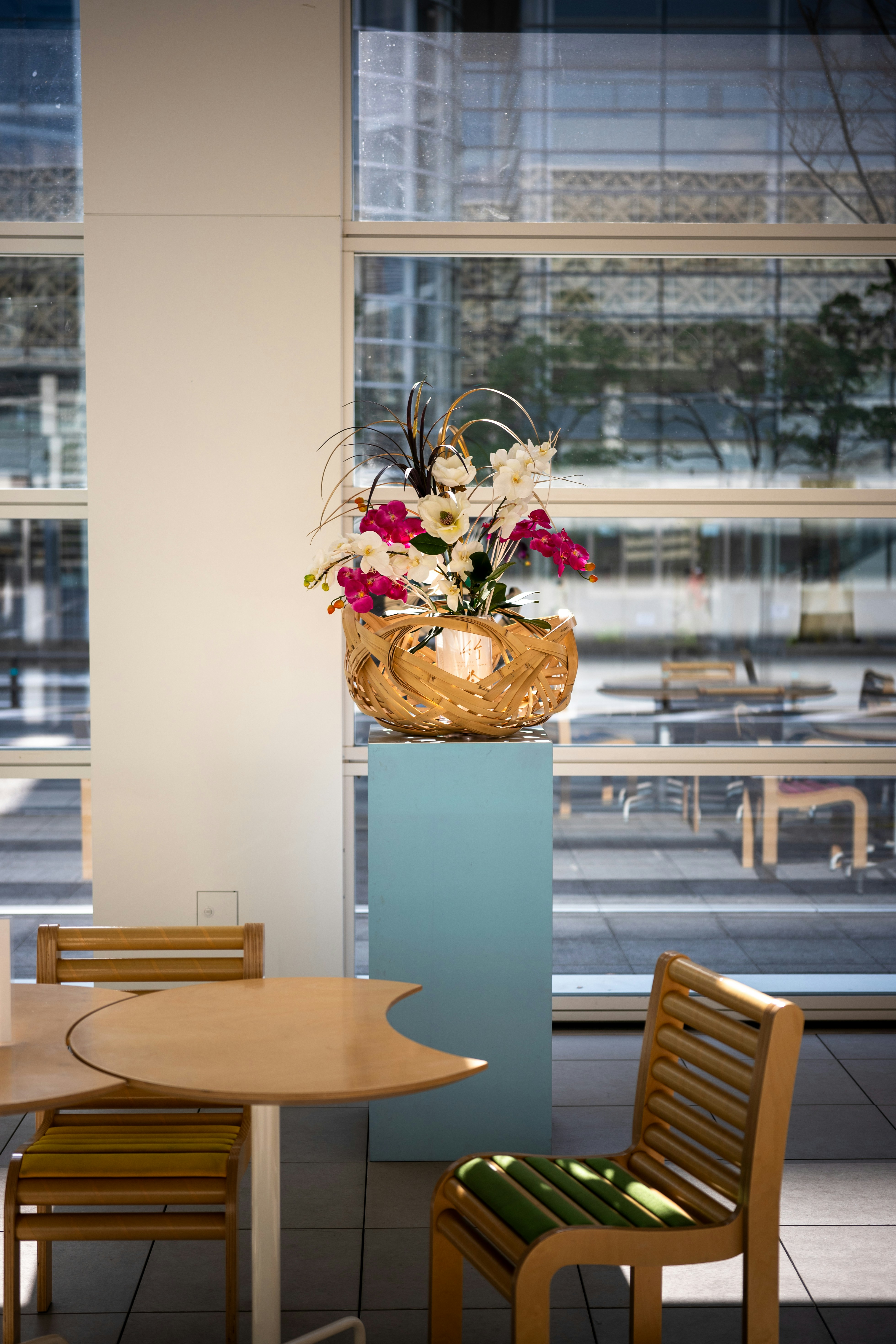 A table with a vase of flowers on top of it