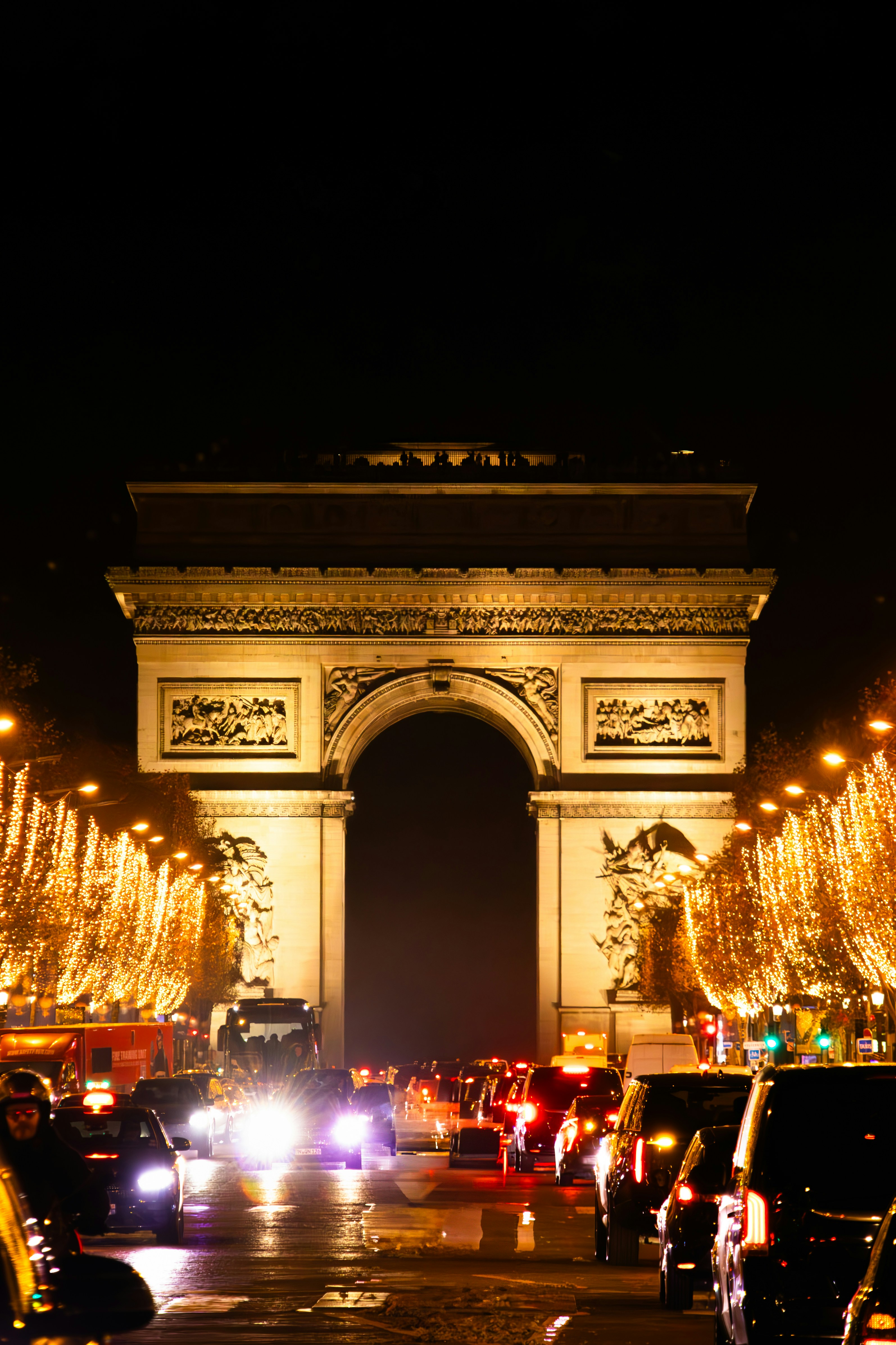 The arc of triumph in paris is lit up at night photo – Free Arc de ...