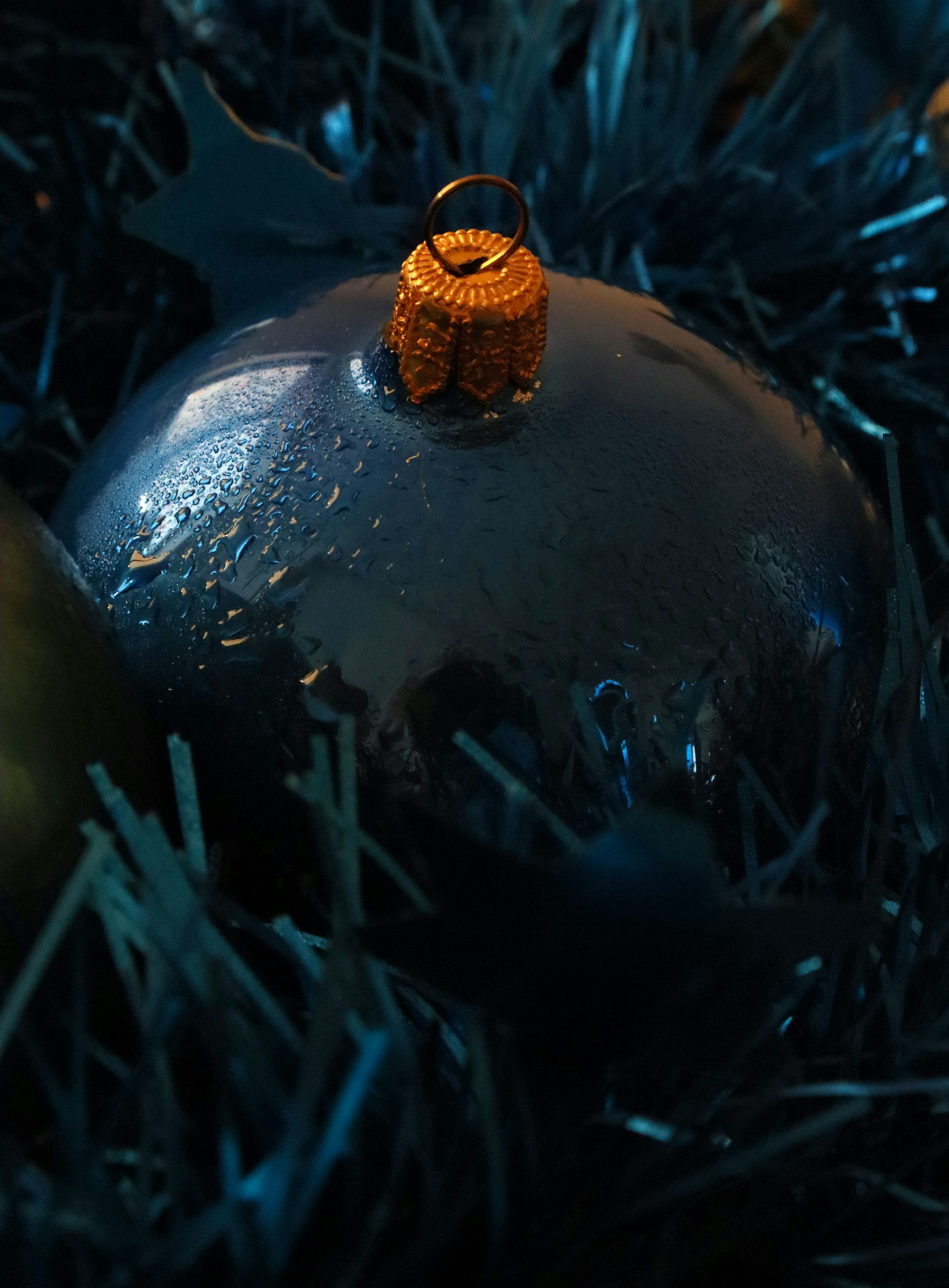 Glimmering Blue Bauble Under Frost-Dusted Night Glow