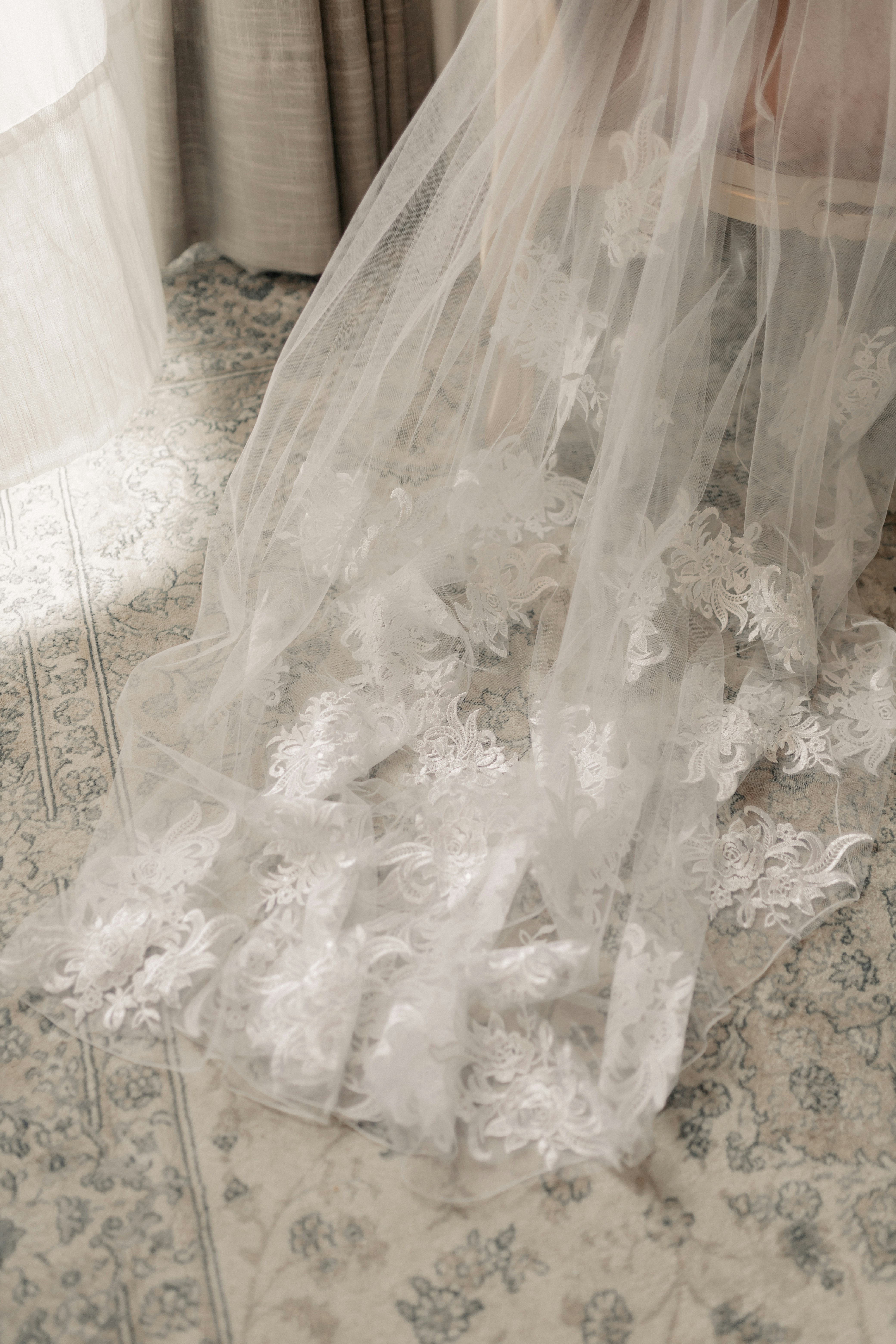 Lace-Cascade on a Vintage Rug: Delicate Embroidery in Quiet Light