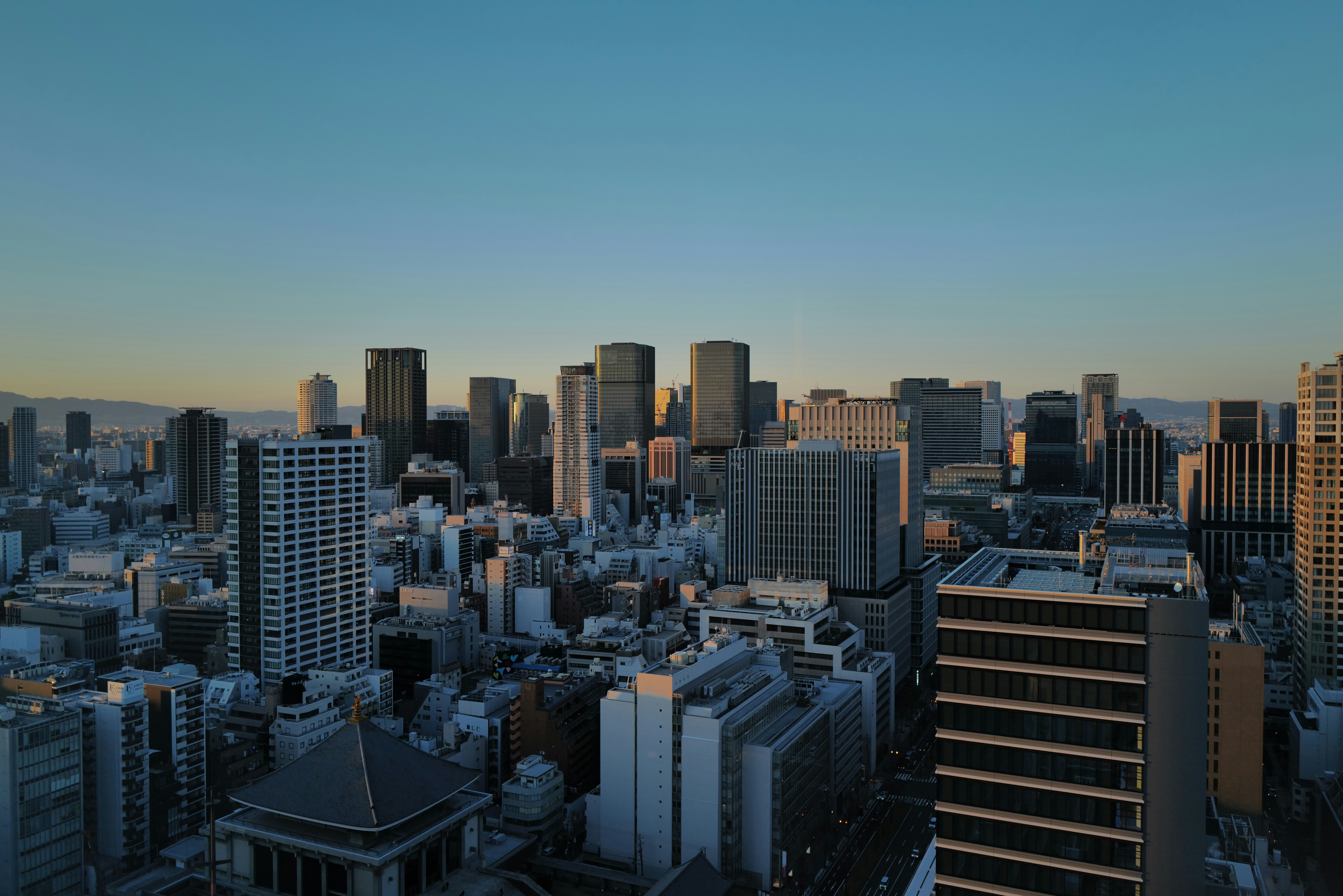 A view of a city from the top of a building photo – Free Building Image ...