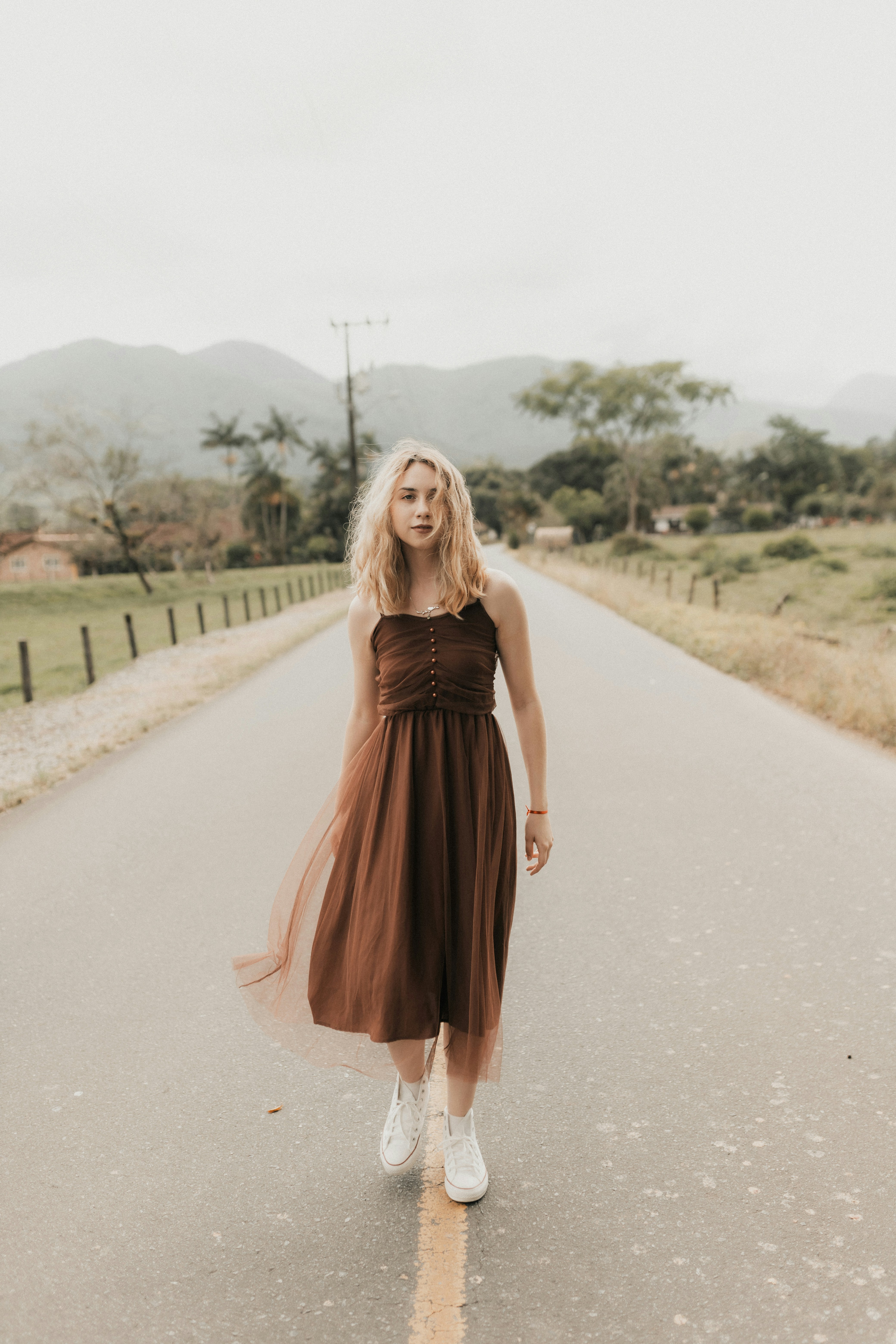 Midroad Muse: A Blonde in Brown Tulle on a Quiet Rural Highway