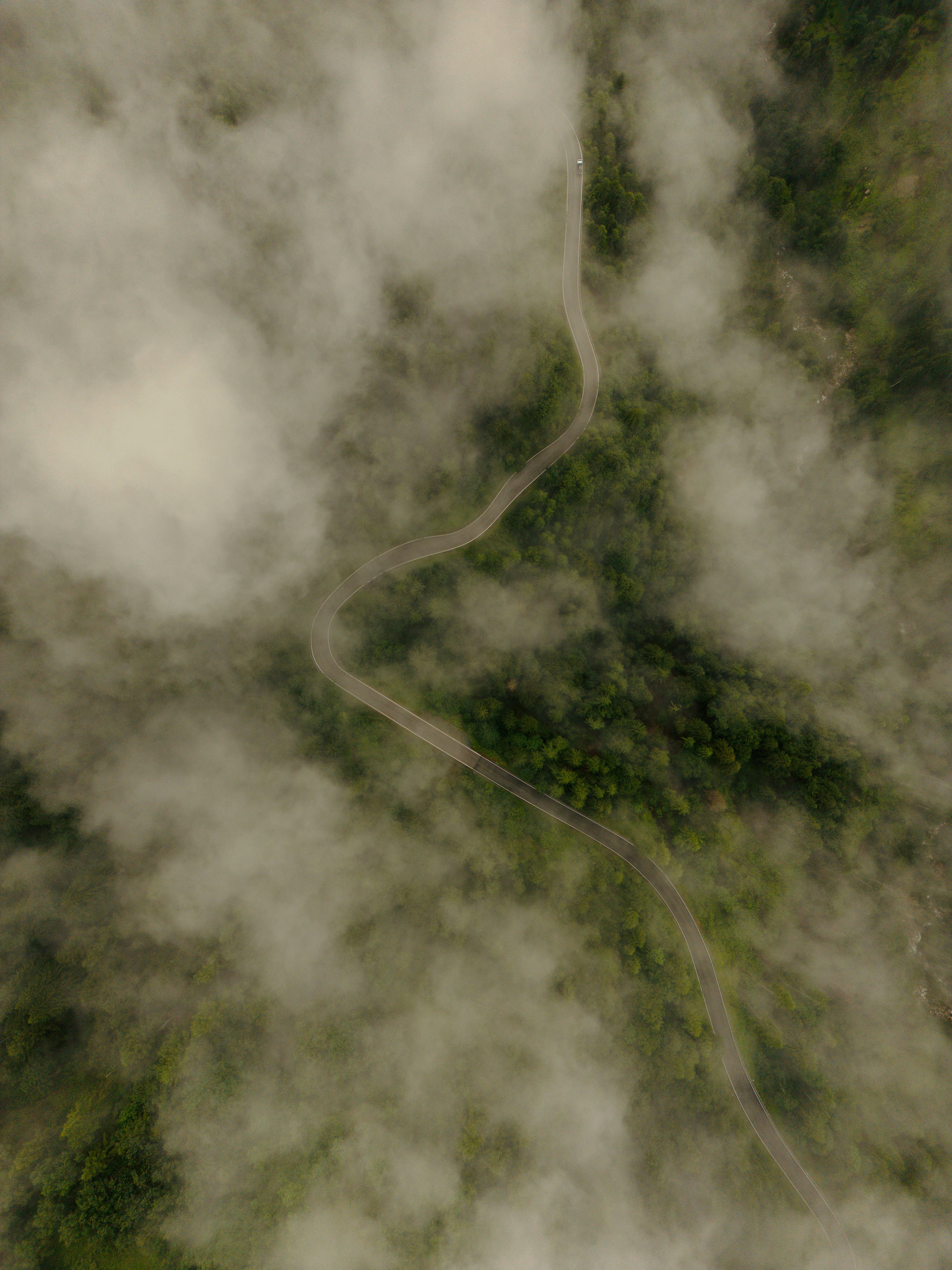 This is a picture of a road with clouds above itDaniel Gomez