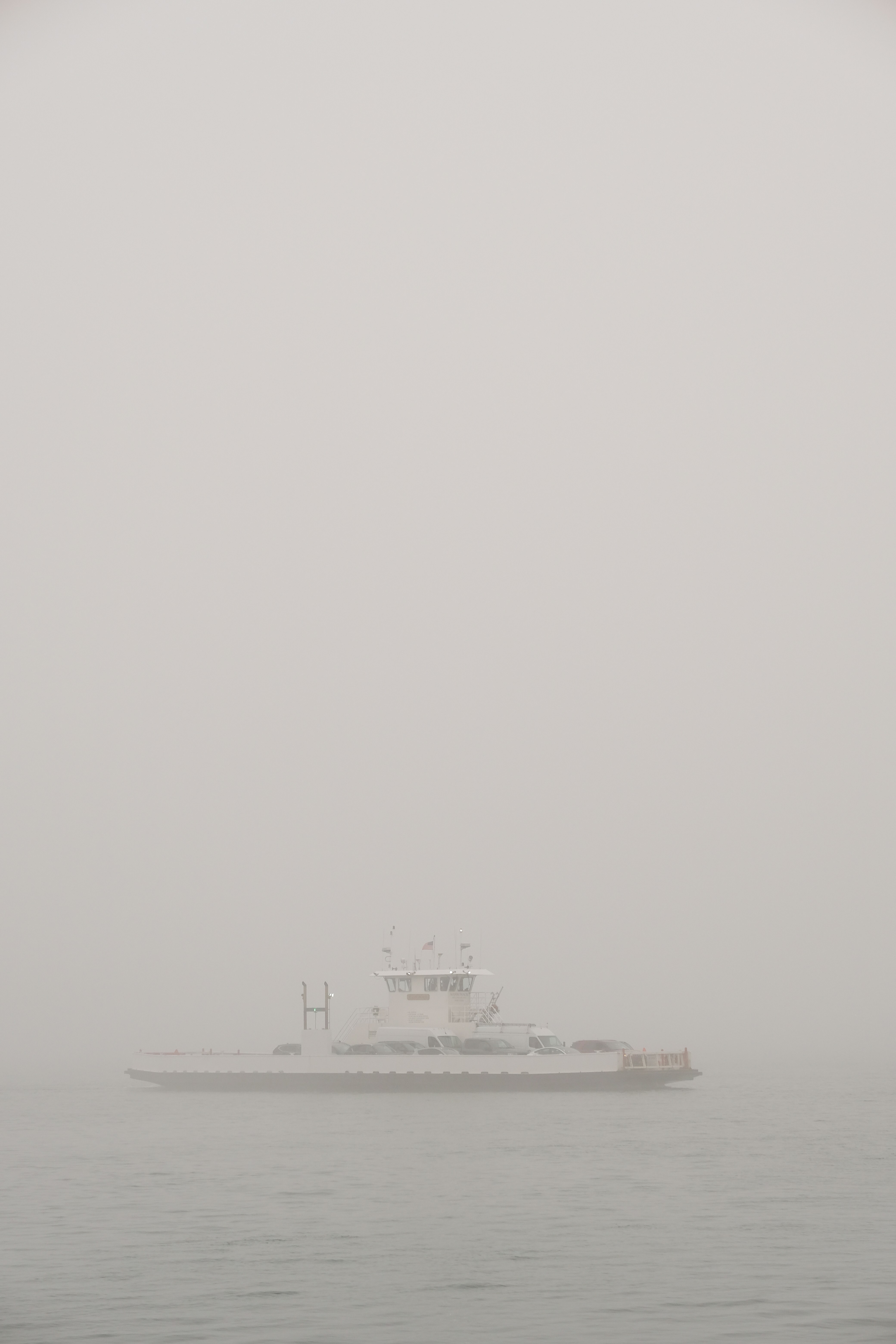 Veiled Ferry in a Pale Morning Fog