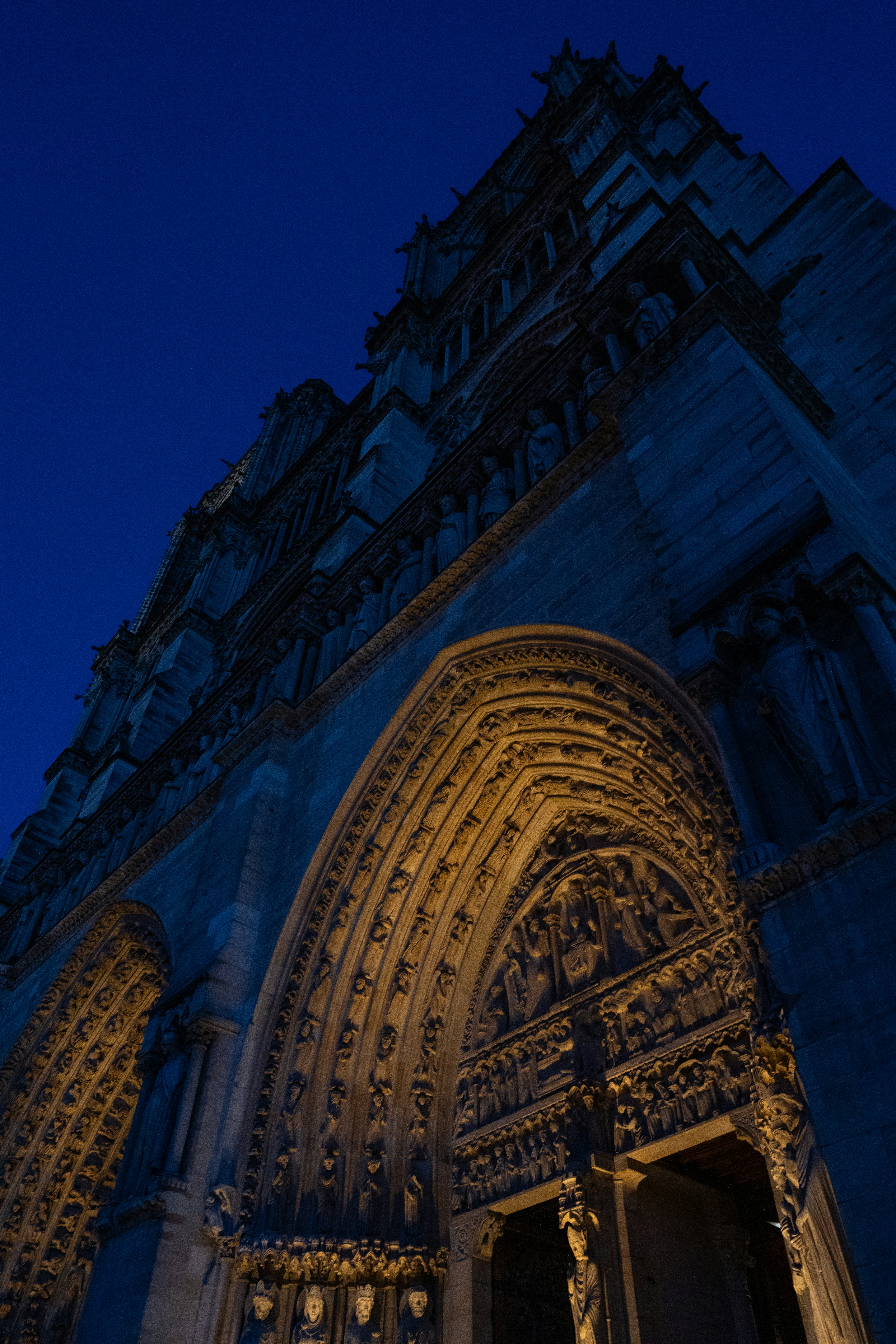 A very tall building with a clock on it's side photo – Free Notre dame ...