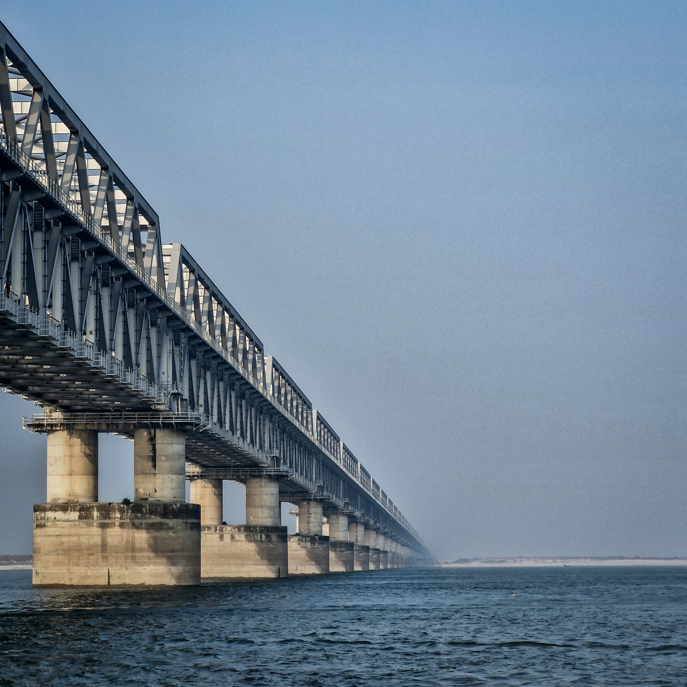 A large bridge over a large body of water photo – Free Water Image on ...