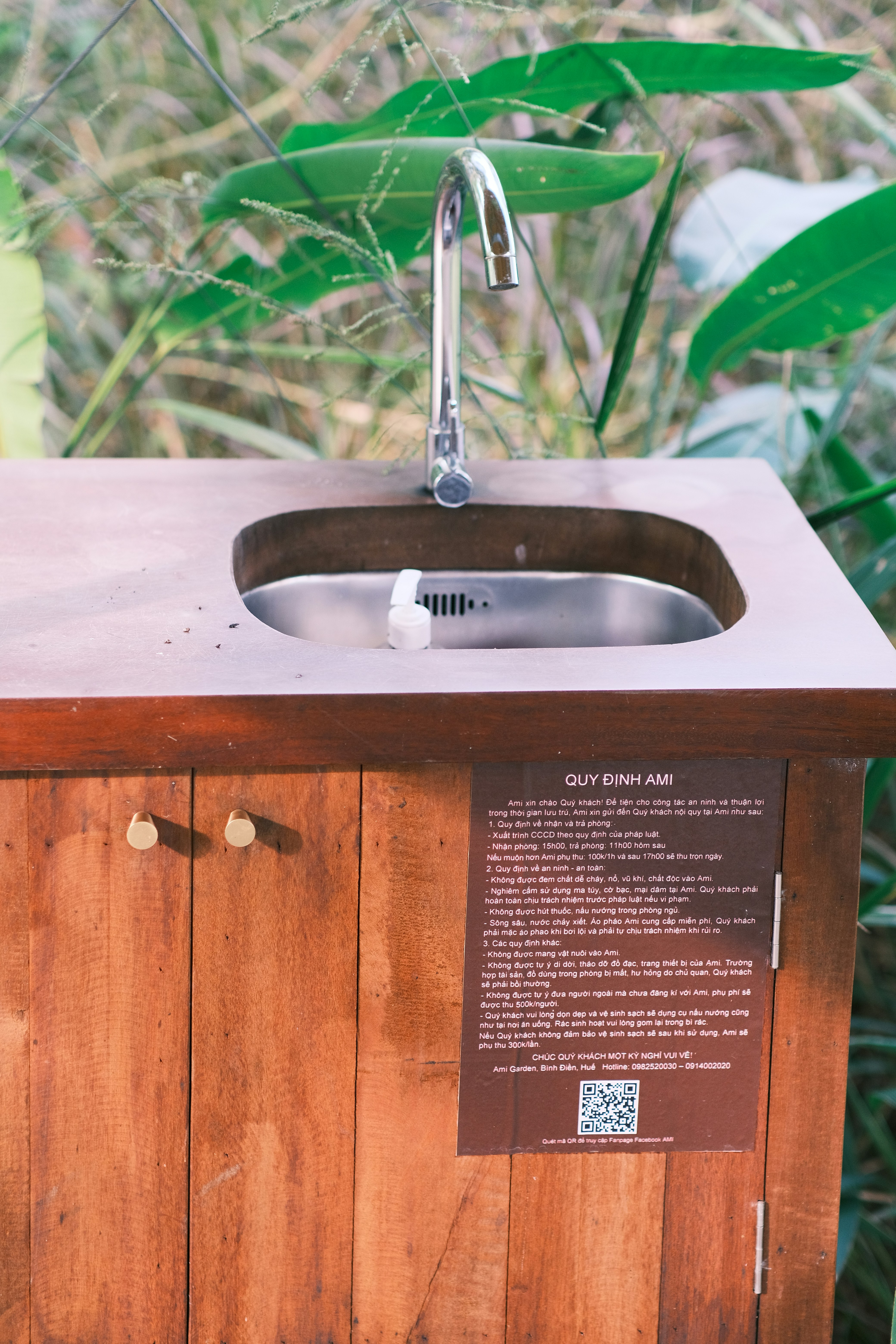 A sink made out of a wooden cabinet