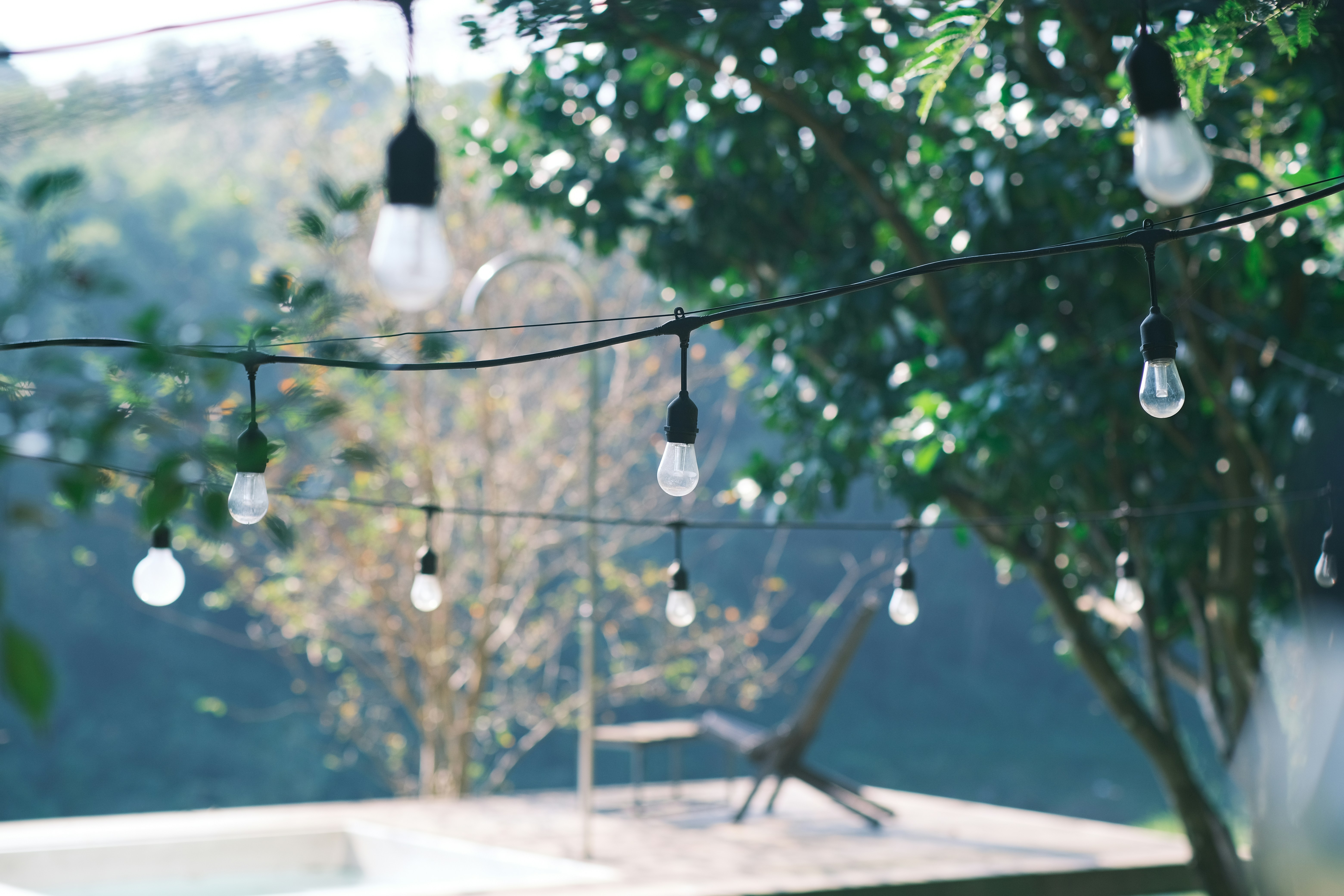 A patio with a lot of lights hanging from it photo – Free Summer Image ...