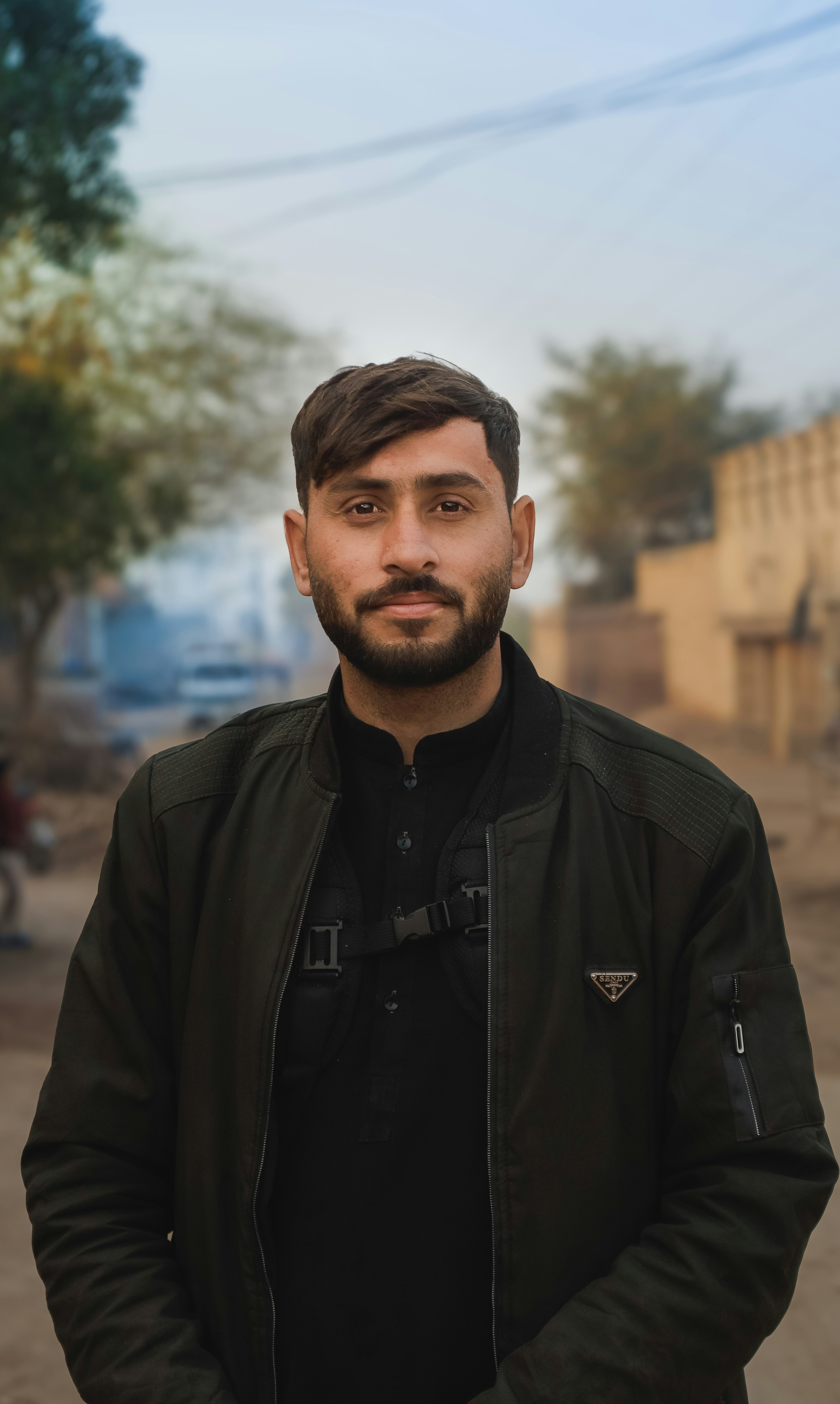 A man standing in the middle of a dirt road photo – Free Pakistan Image ...