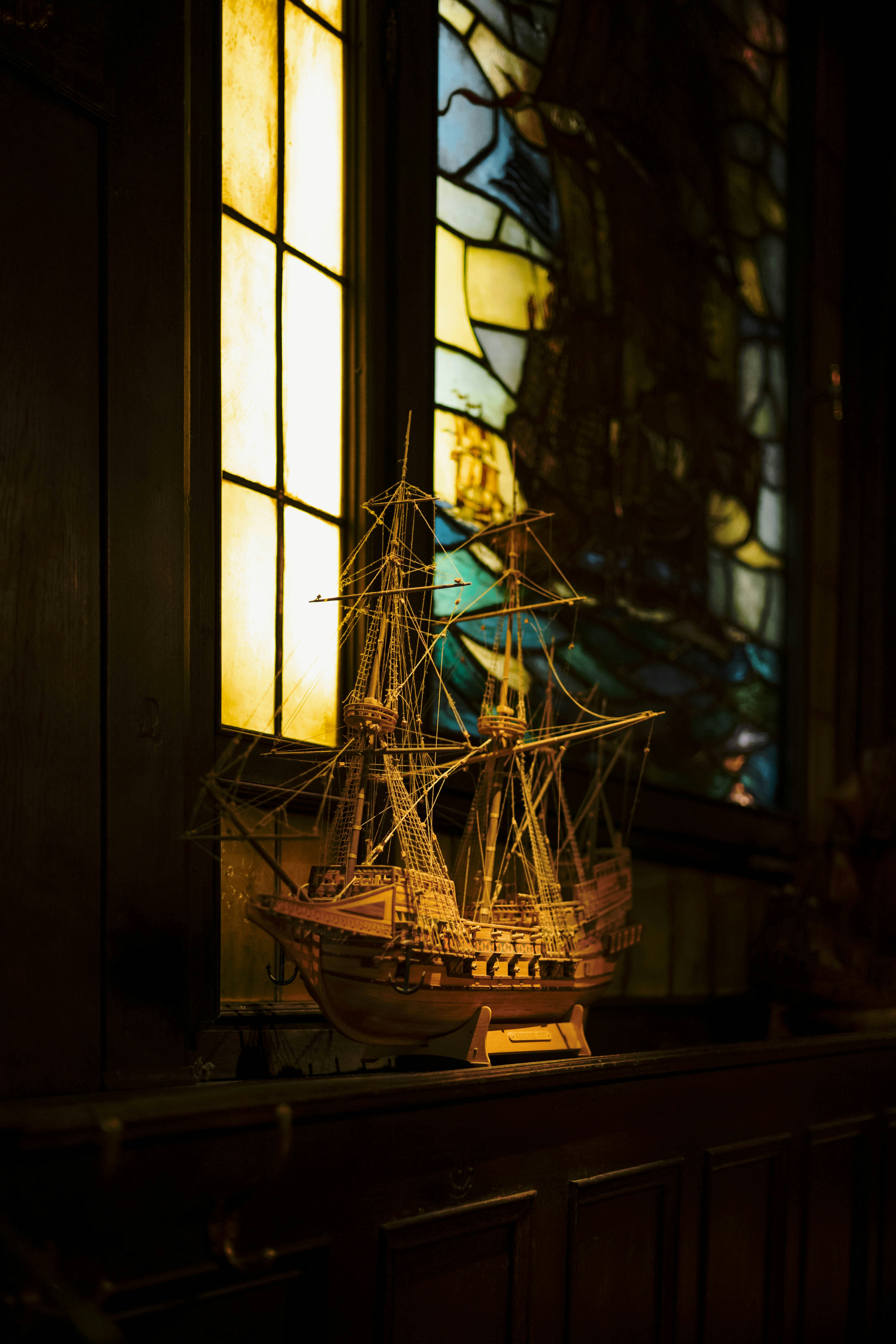 Amber-lit Galleon Amid Cathedral Glass