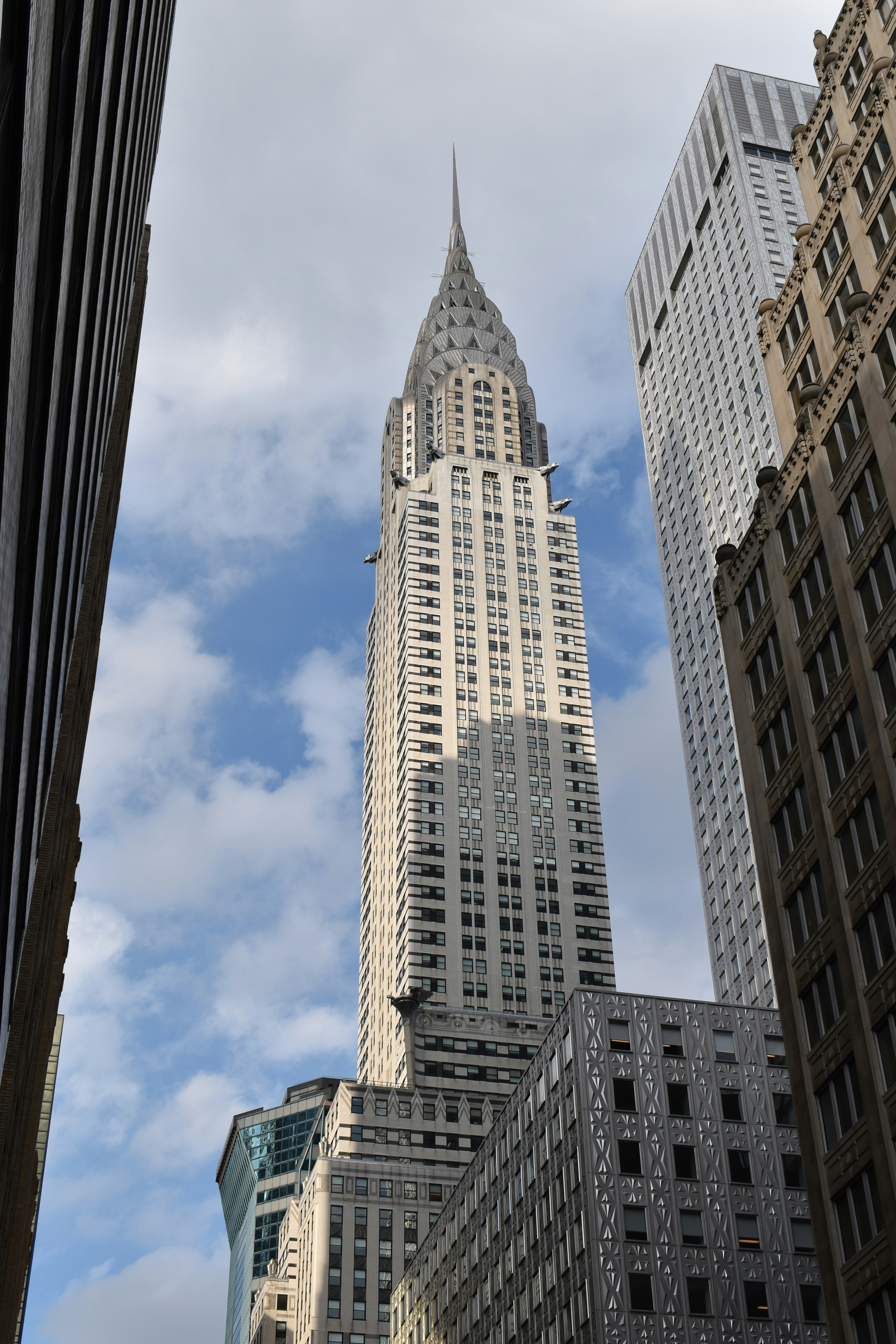 A very tall building towering over a city photo – Free New york city ...