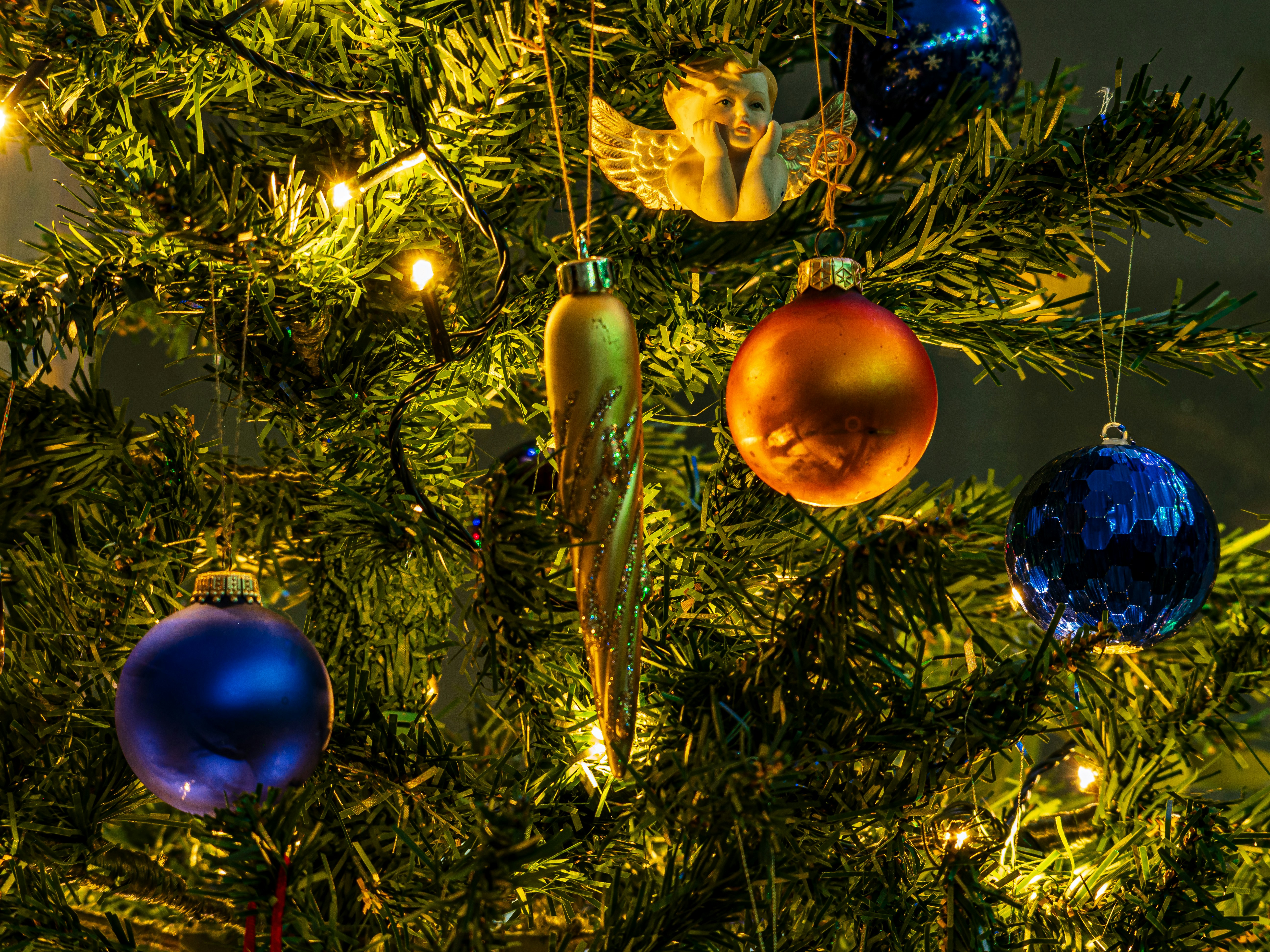 A close up of a christmas tree with ornaments photo – Free Christmas ...